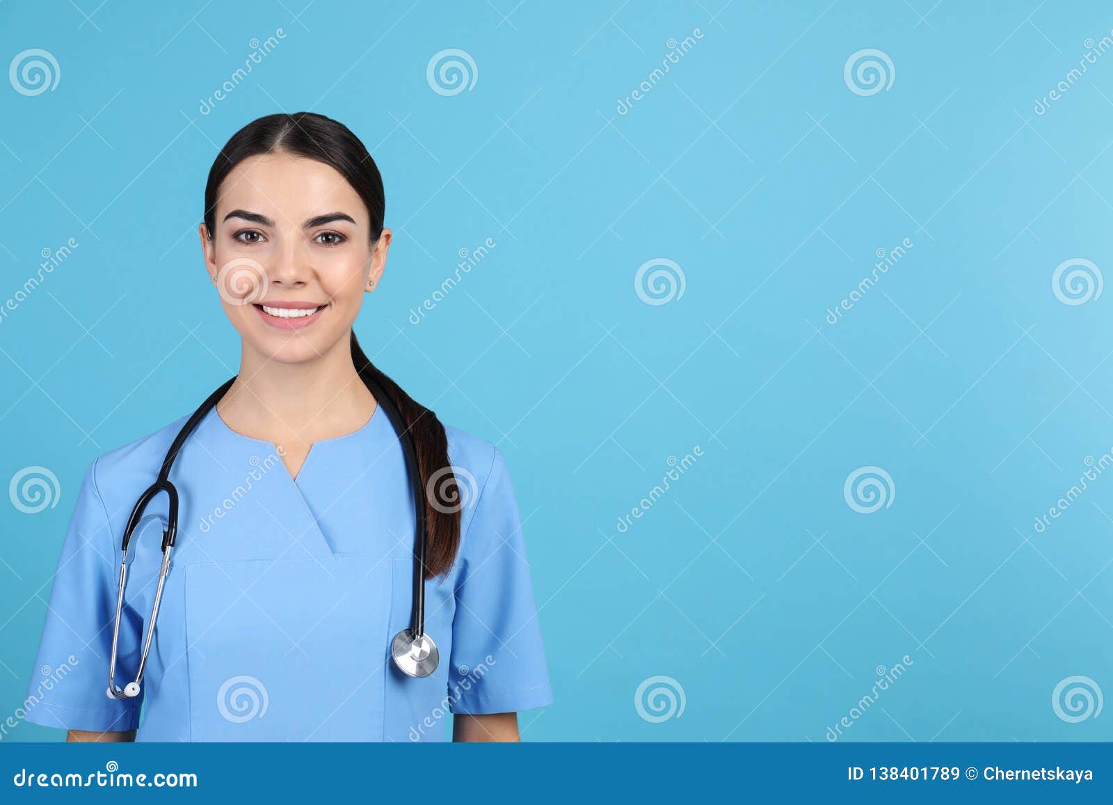 Portrait of Medical Assistant with Stethoscope on Color Background ...