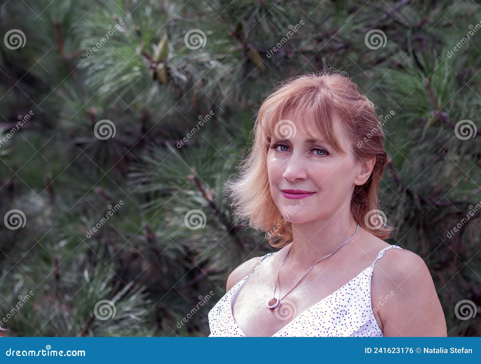 Portrait Of A Middle Aged Blonde Woman Against The Background Stock