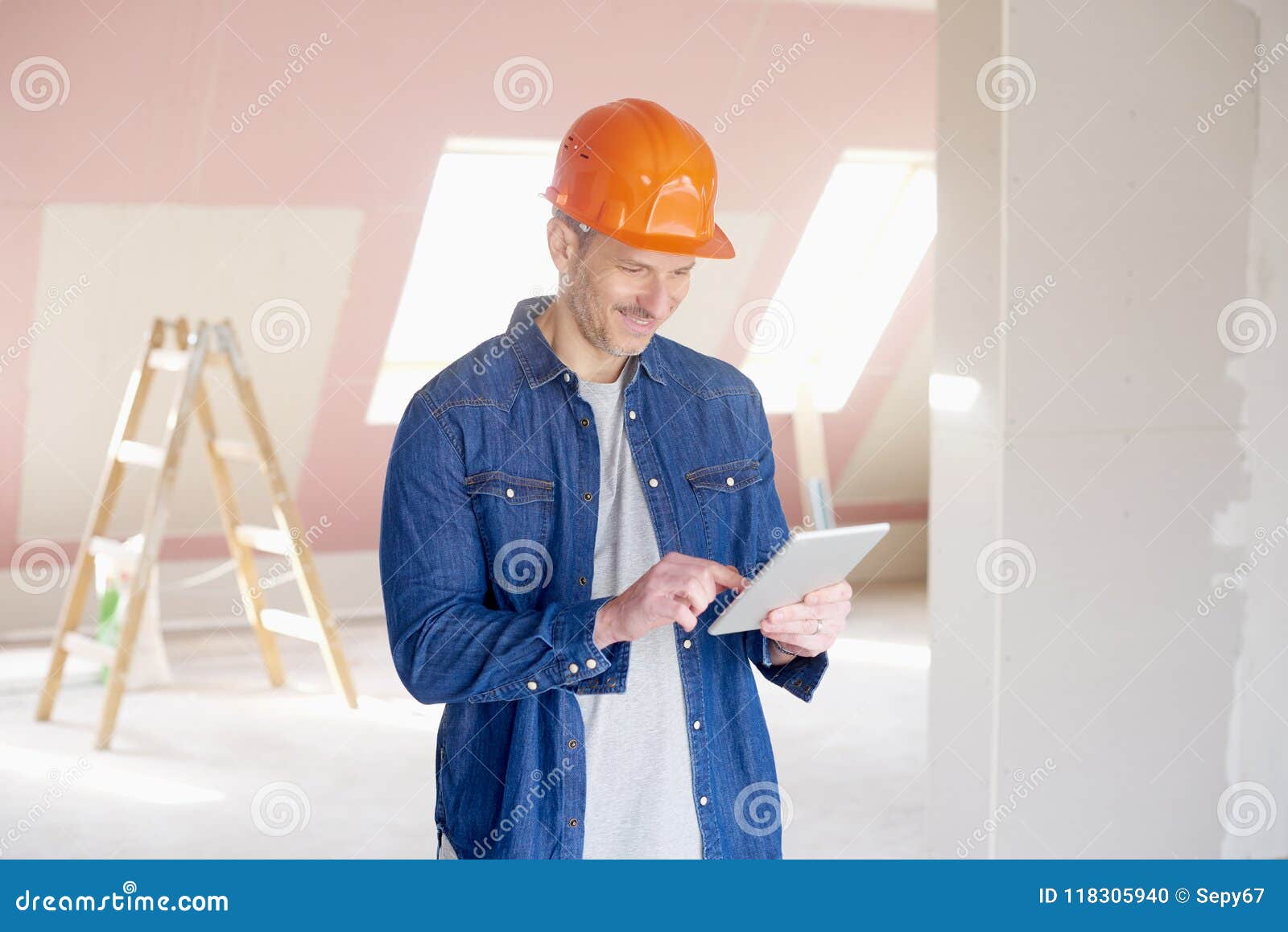 Construction Worker Using Digital Tablet while Working Stock Photo ...
