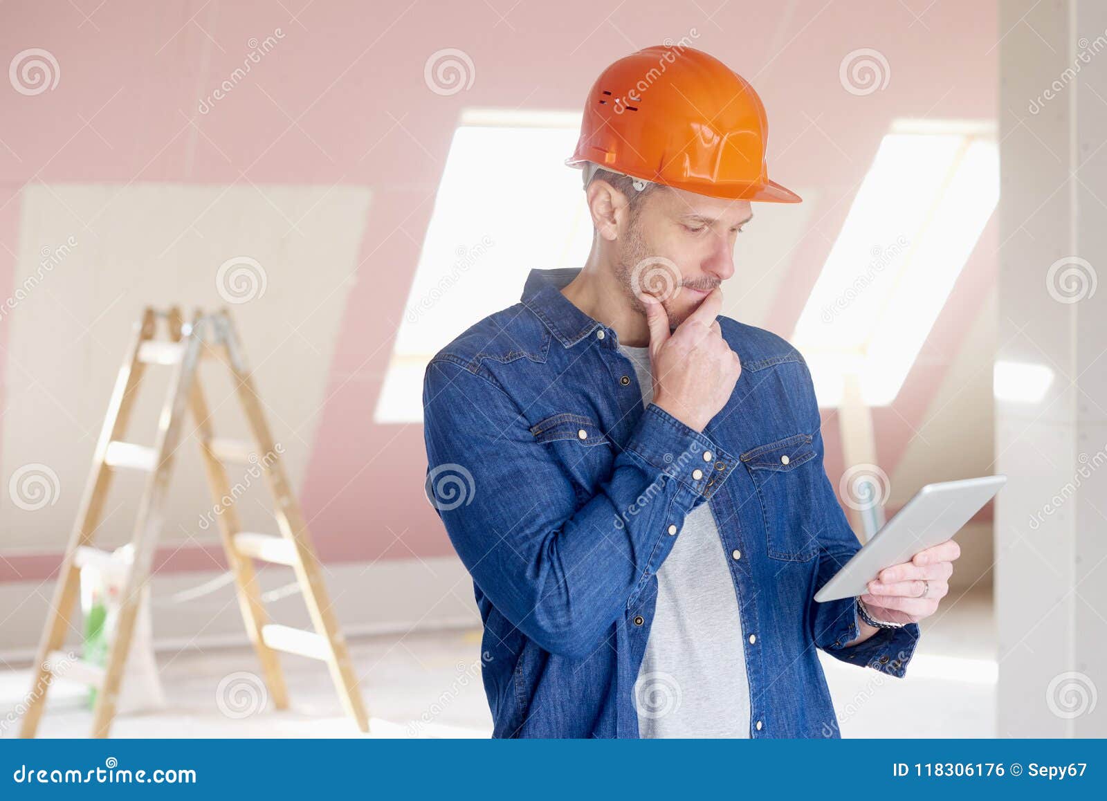 Construction Worker Using Digital Tablet while Working Stock Photo ...