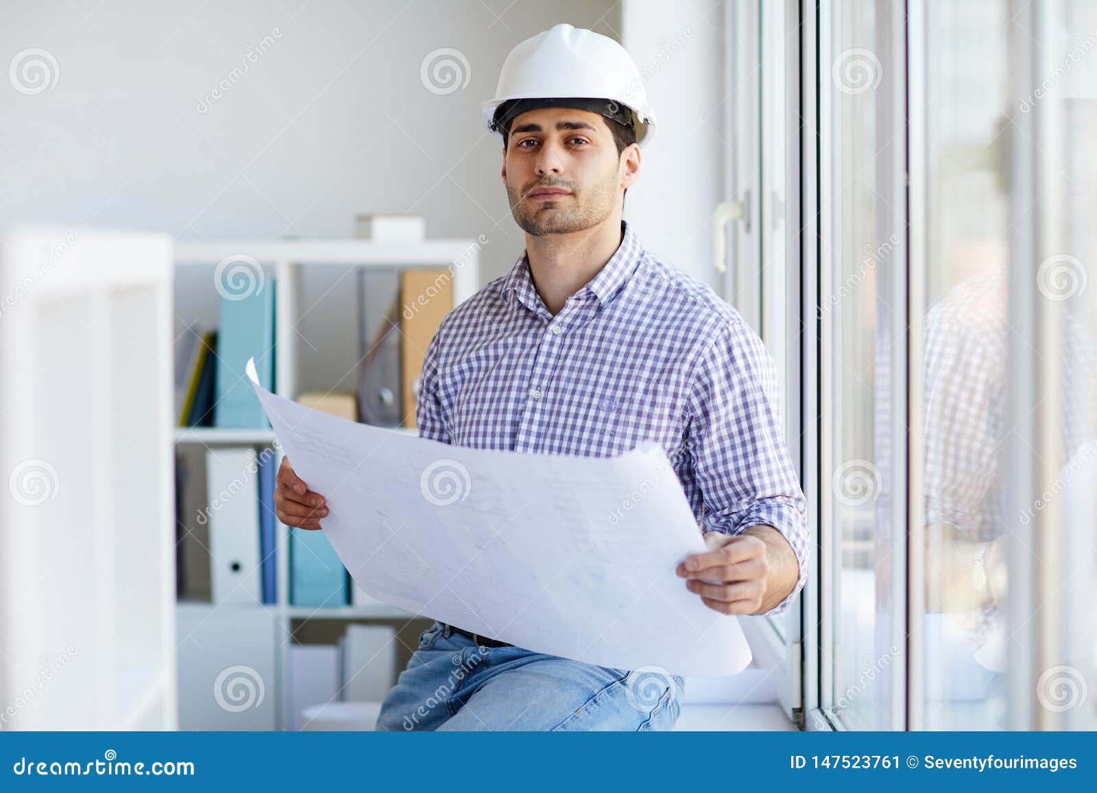 Middle-Eastern Engineer Holding Plans Stock Image - Image of engineer ...