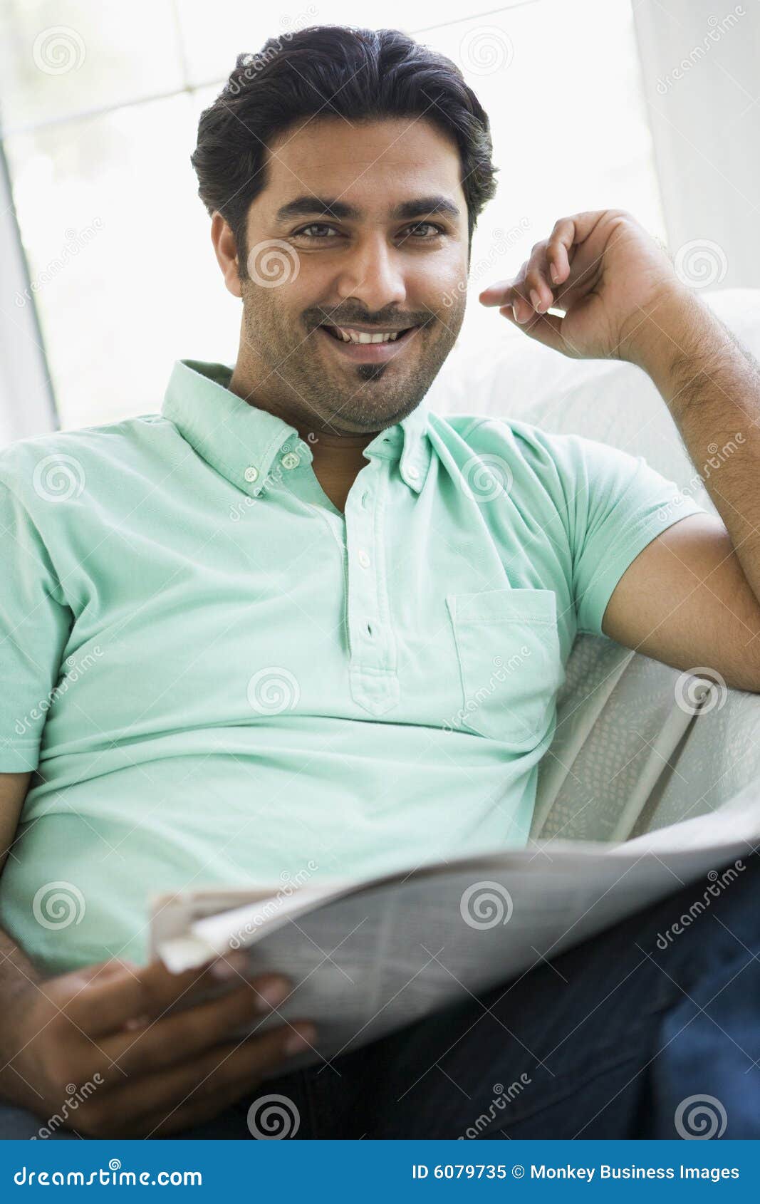 Portrait of a Middle Eastern Man Reading Stock Image - Image of couch ...