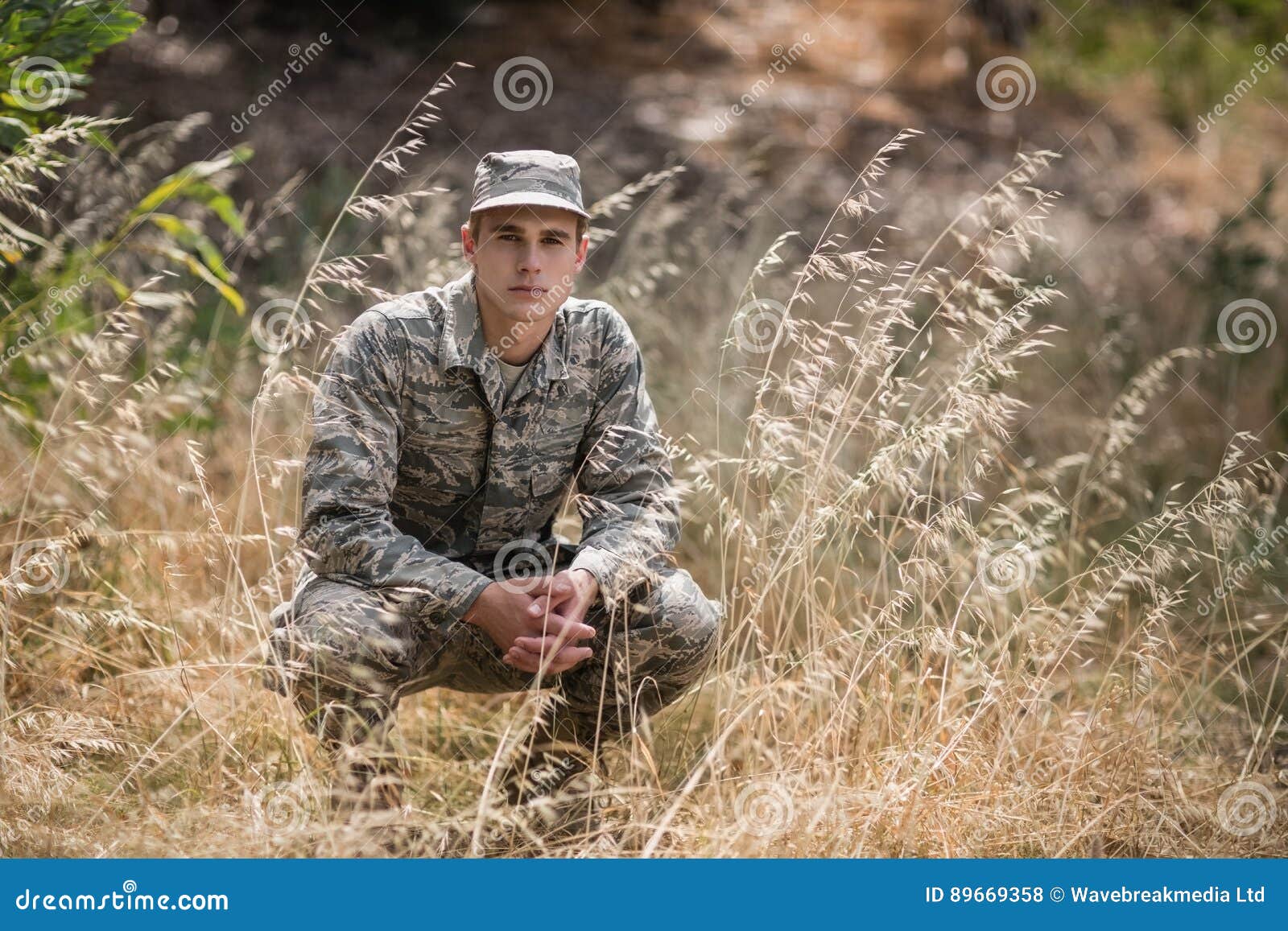 Portrait of Military Soldier Crouching in Grass Stock Photo - Image of ...