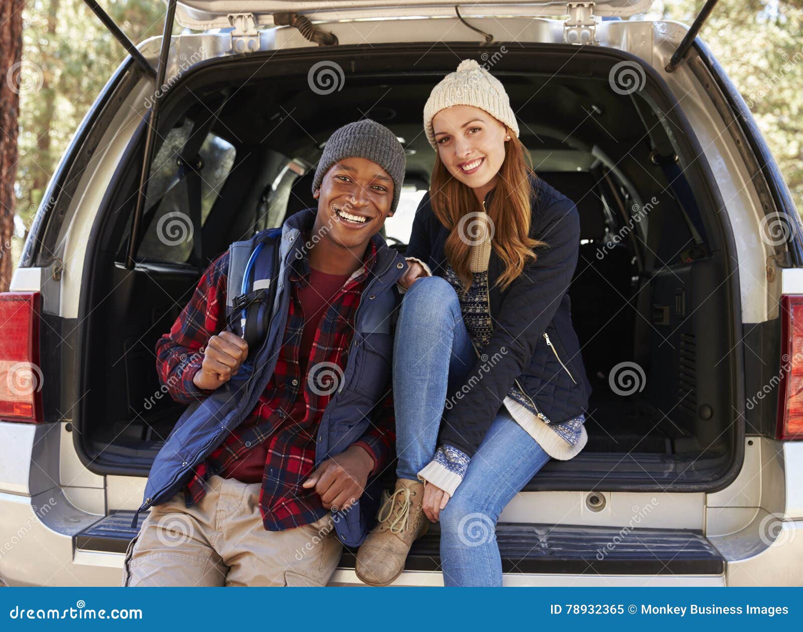 Portrait of Mixed Race Couple Sitting in Open Back of a Car Stock Image ...