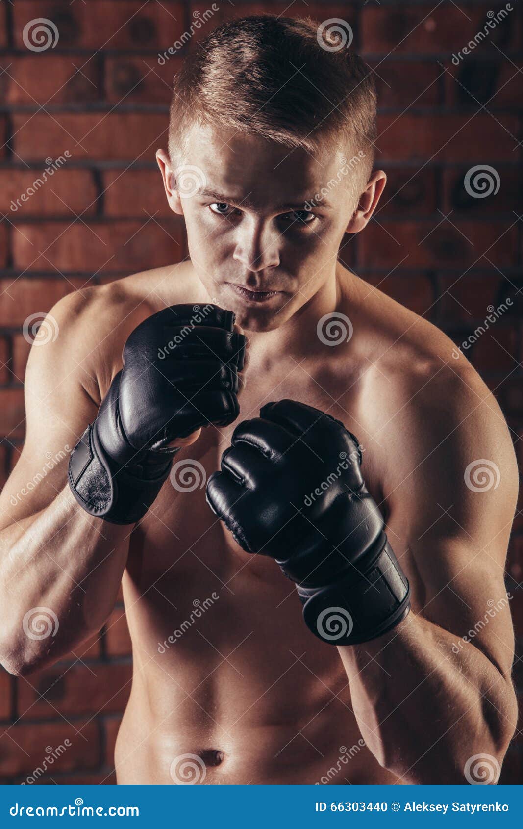 Portrait of Mma Fighter in Boxing Pose Against Brick Wall Stock Photo ...