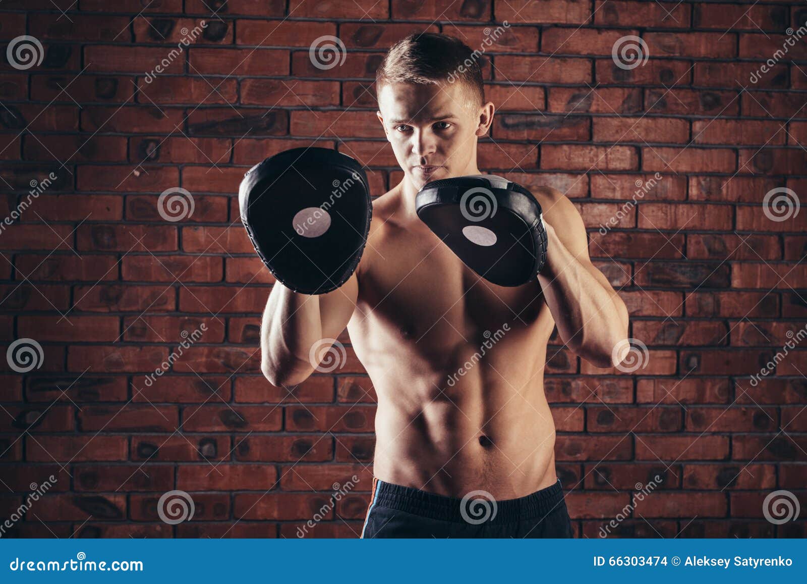 Portrait of Mma Fighter in Boxing Pose Against Brick Wall Stock Photo ...