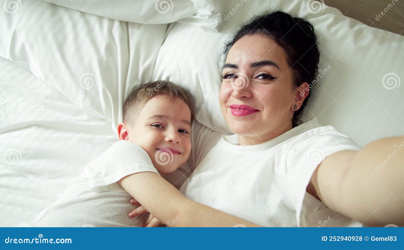 Portrait Happy Cute Funny Cheerful Mom And Son Gently Hugging Daughter