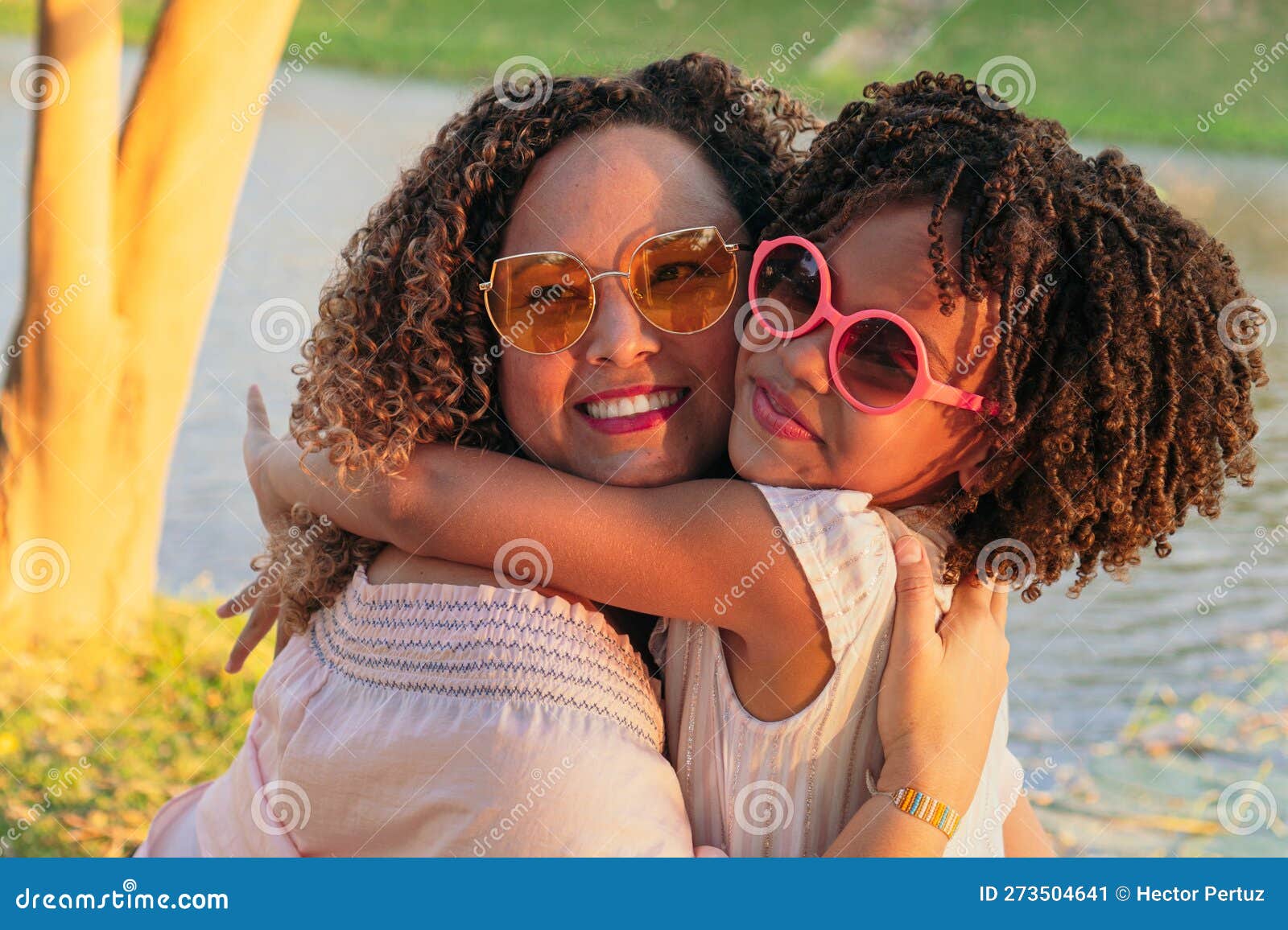 Portrait Of A Mother And Her Daughter In The Park During Summer