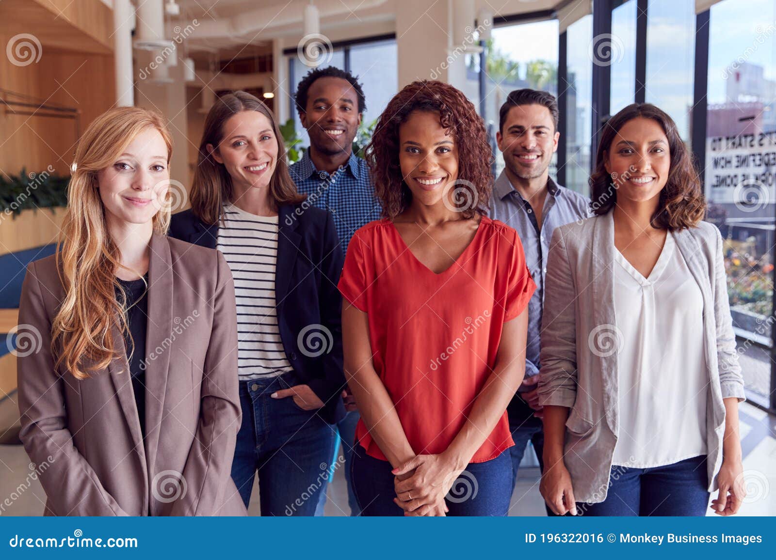 Portrait of Multi-Cultural Business Team Standing in Modern Open Plan ...