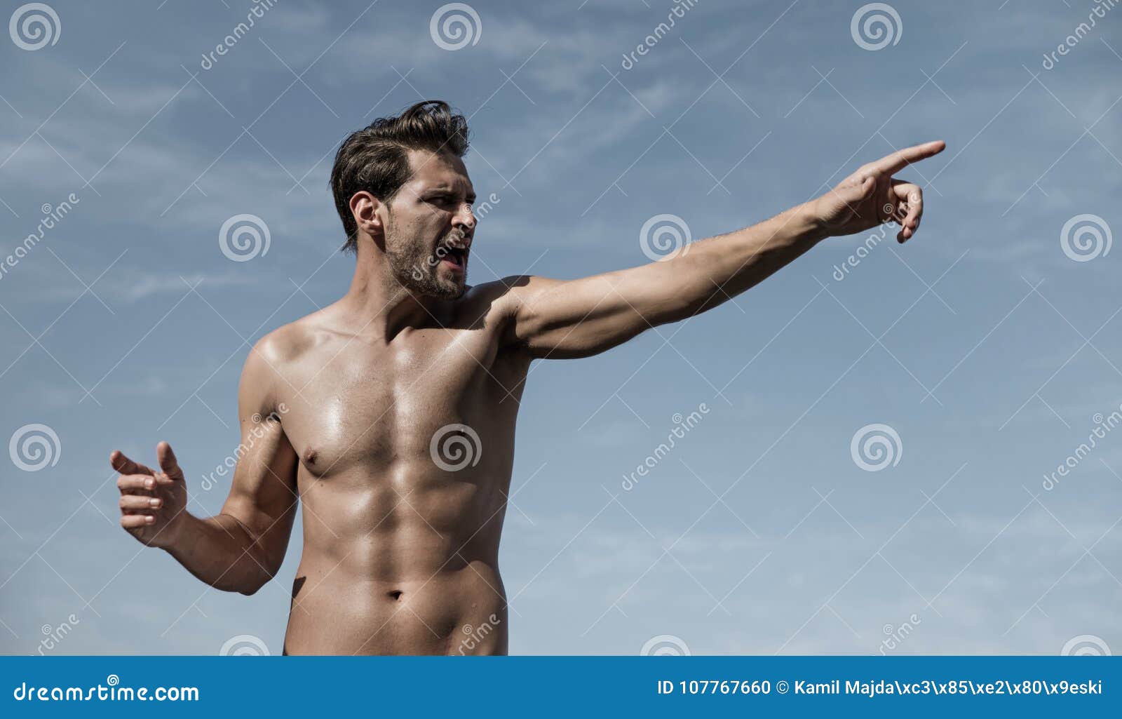 Portrait of a Muscular Man Making a Victory Gesture Stock Photo - Image ...