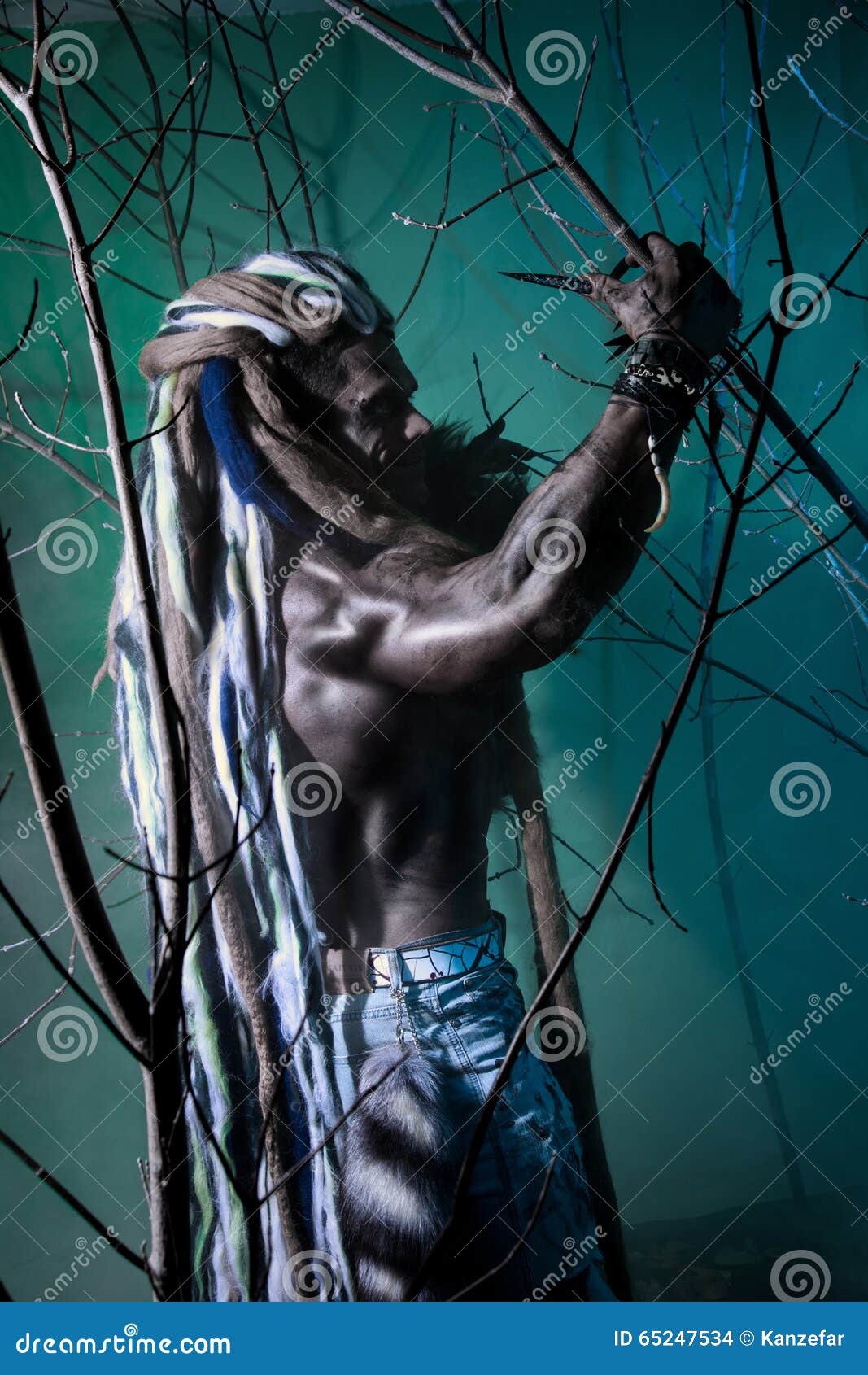 Portrait Muscular Werewolf with Dreadlocks among the Branches of Stock ...