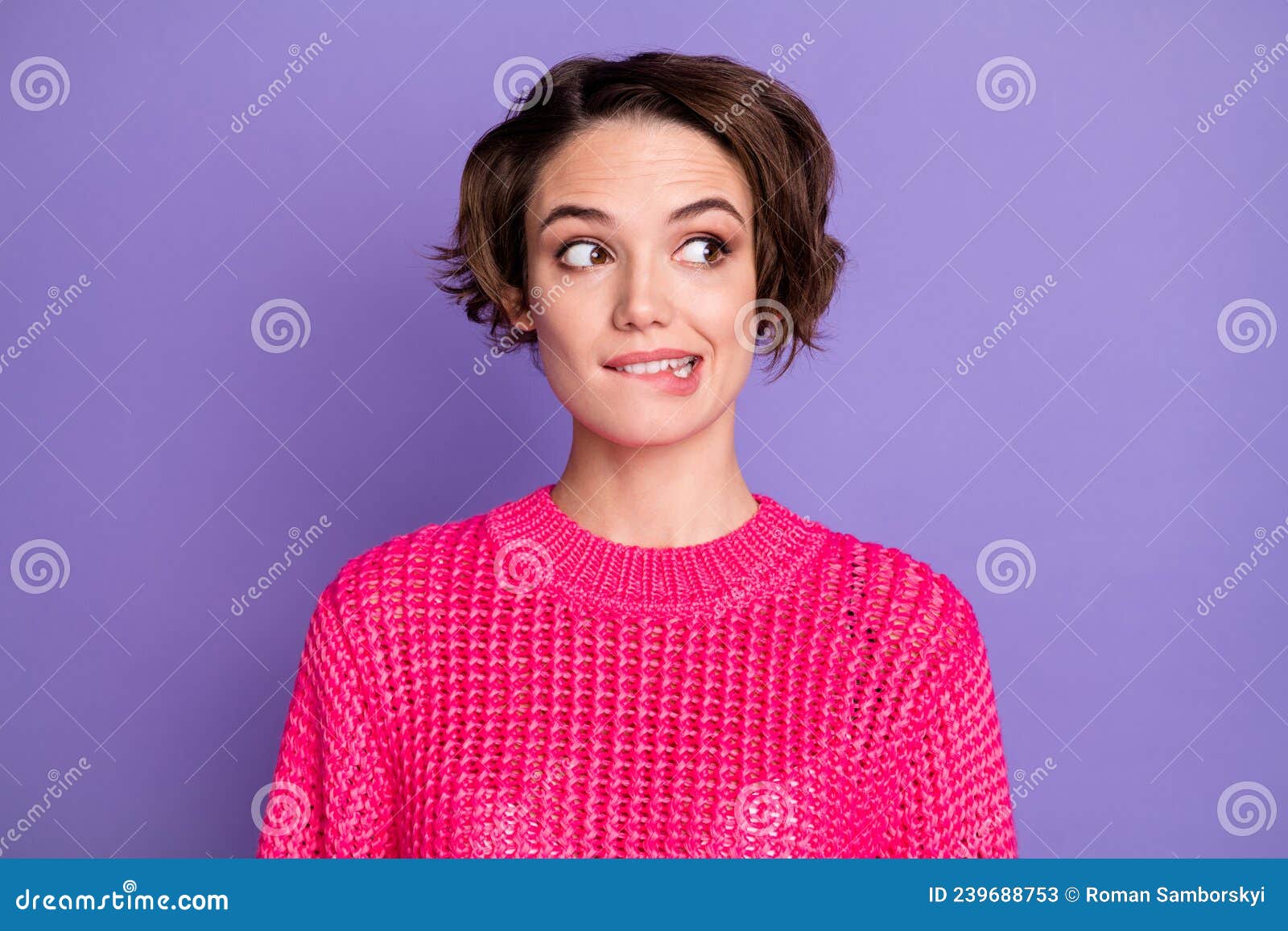 Portrait Of Nervous Girl Look Empty Space Bite Lip Wear Pink Sweater Isolated On Violet Color
