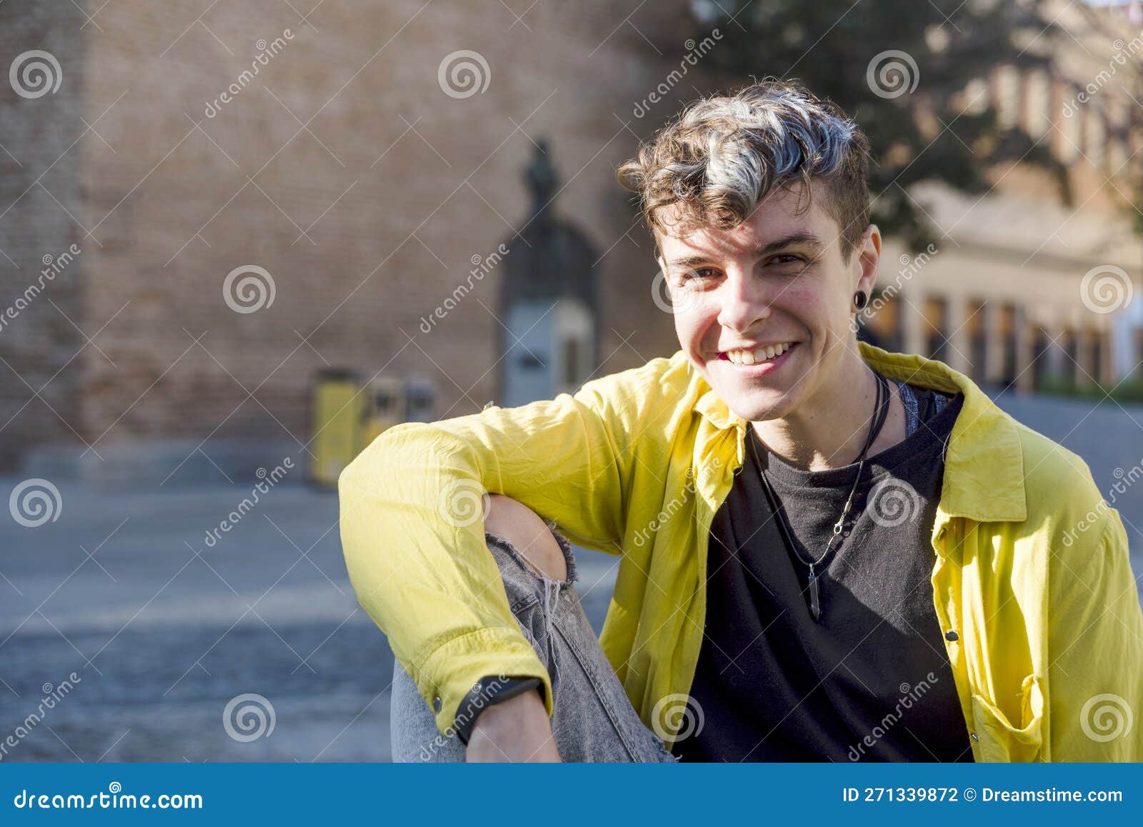 Portrait of a Non Binary Person Looking at Camera while Posing Outdoors ...