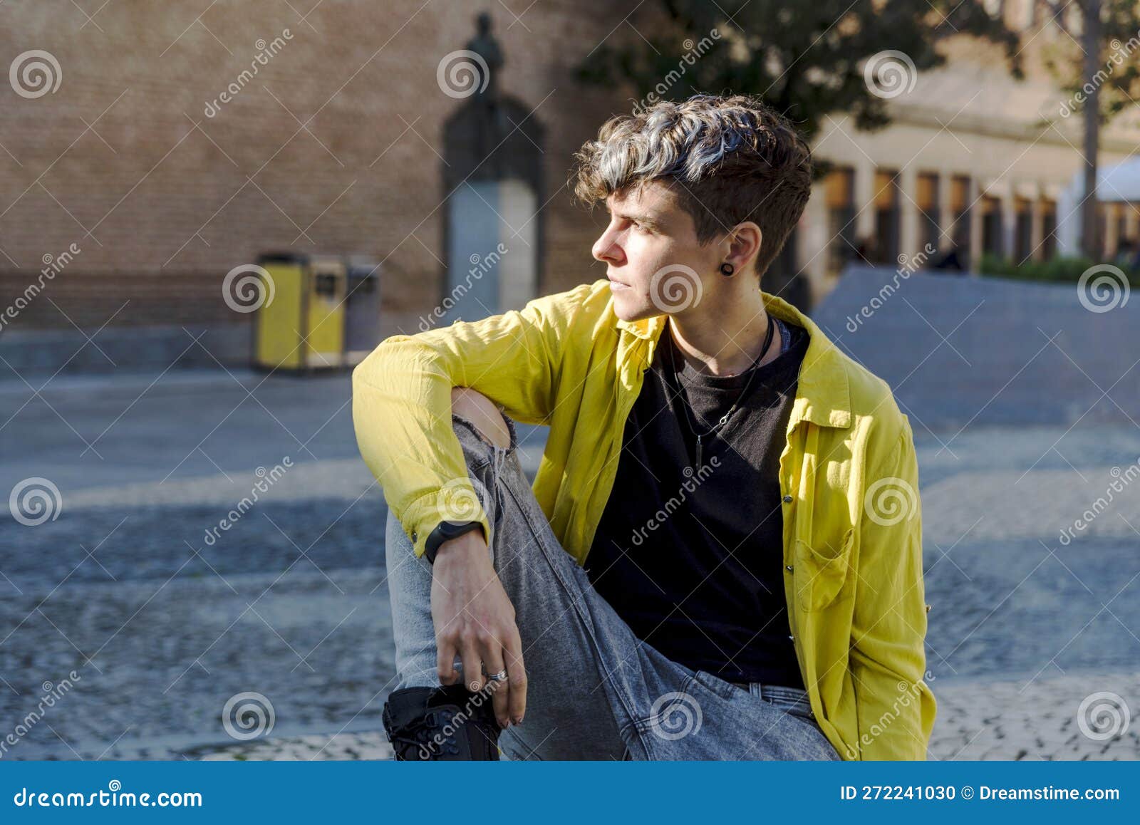 Portrait of a Non Binary Person Looking at Camera while Posing Outdoors ...