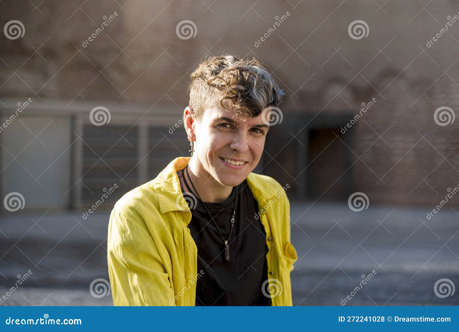 Portrait of a Non Binary Person Looking at Camera while Posing Outdoors ... Portrait of a Non Binary Person Looking at Camera while Posing Outdoors ...