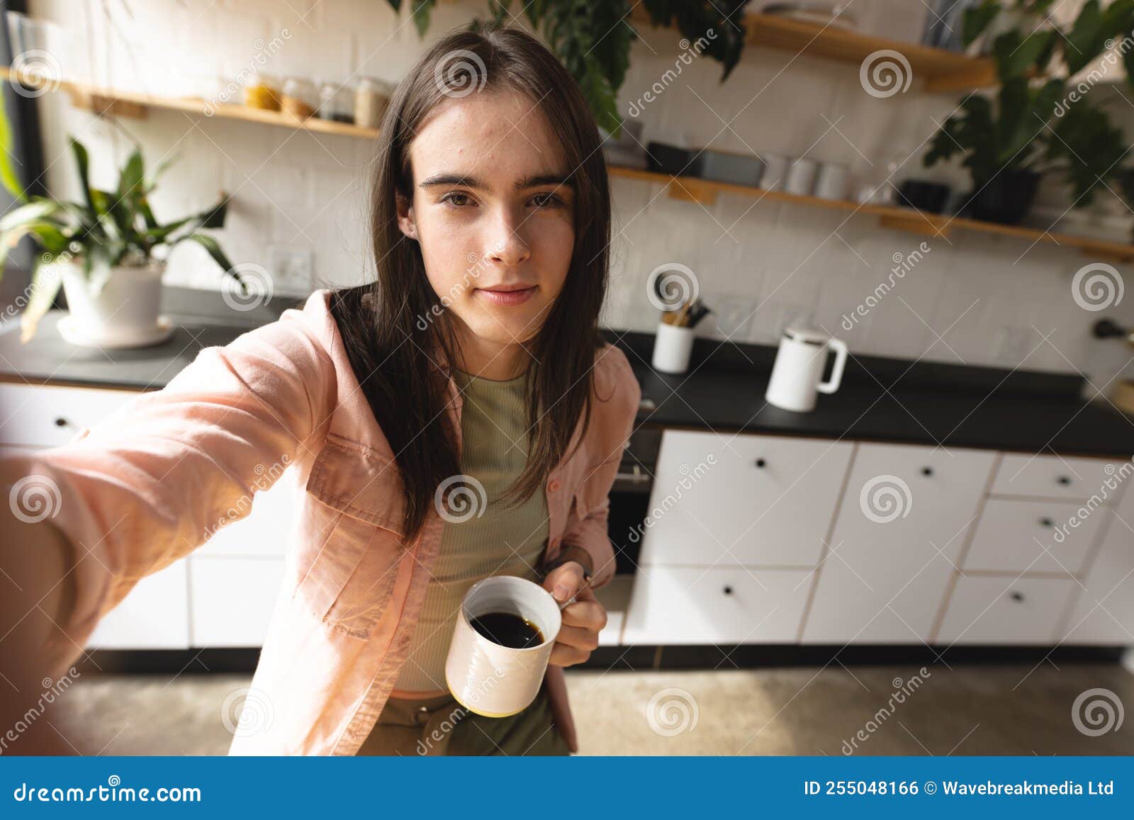 Portrait of Non-binary Trans Woman Holding a Coffee Cup Looking at the ...