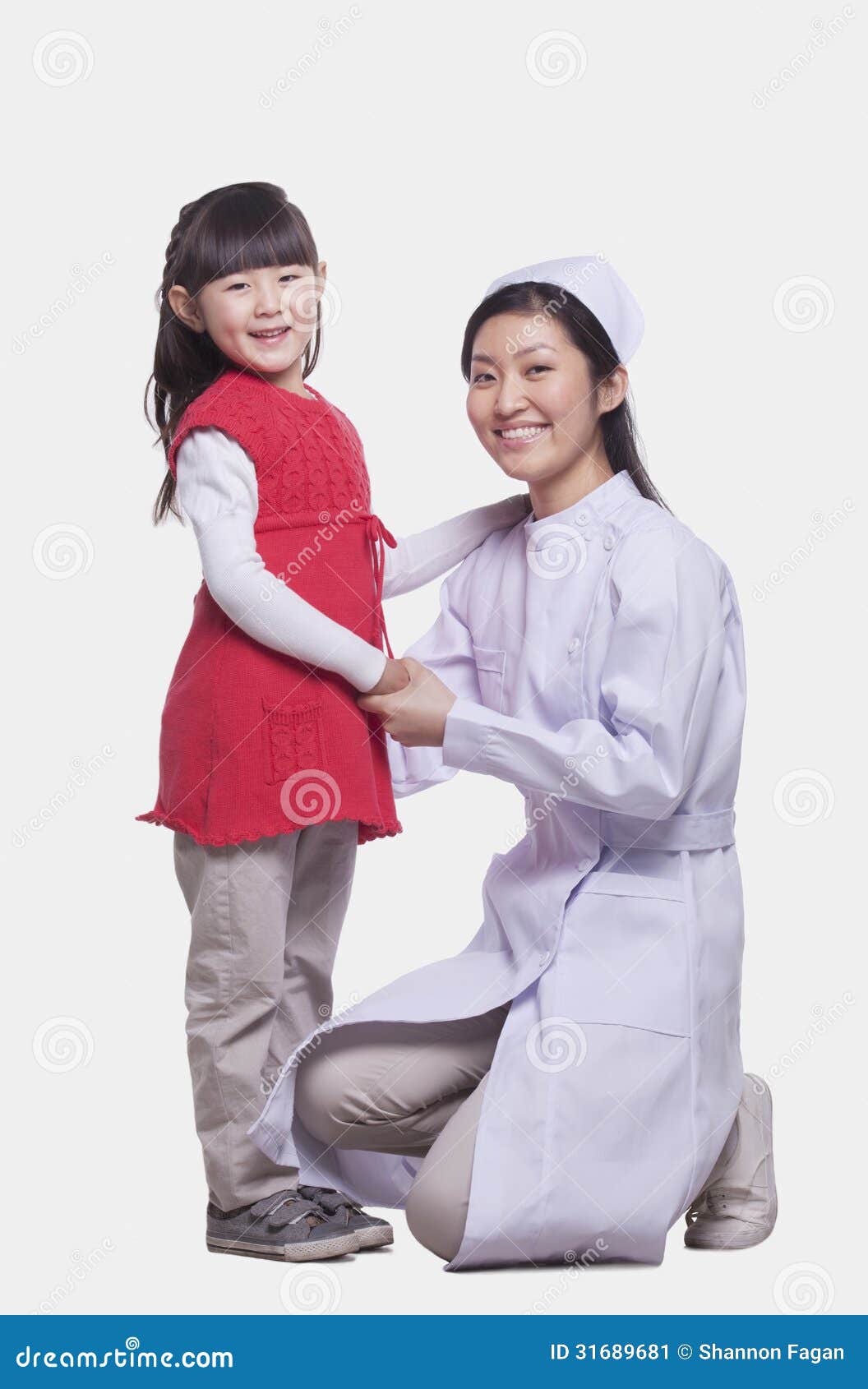 Portrait of Nurse and Child, Kneeling, Studio Shot Stock Image - Image ...