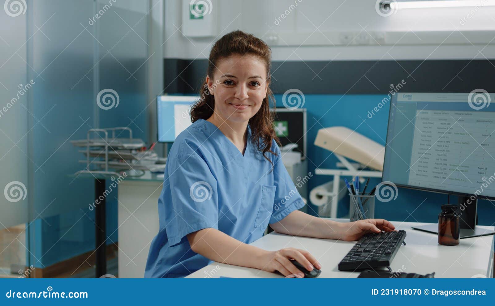Portrait of Nurse Using Computer for Appointments with Patient Stock ...