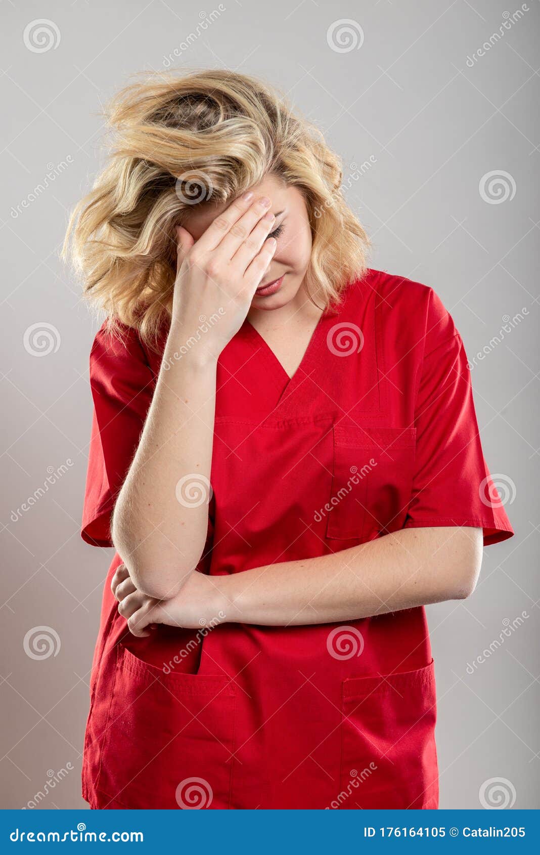 Portrait of Nurse Wearing Red Scrub Making Head Ache Gesture Stock ...