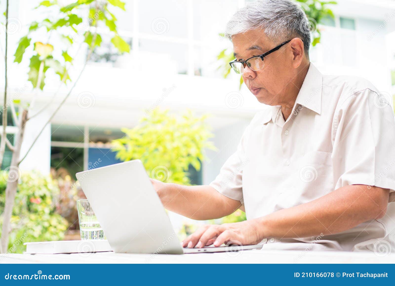 Portrait of Old Elderly Asian Man Using a Computer Laptop in the ...