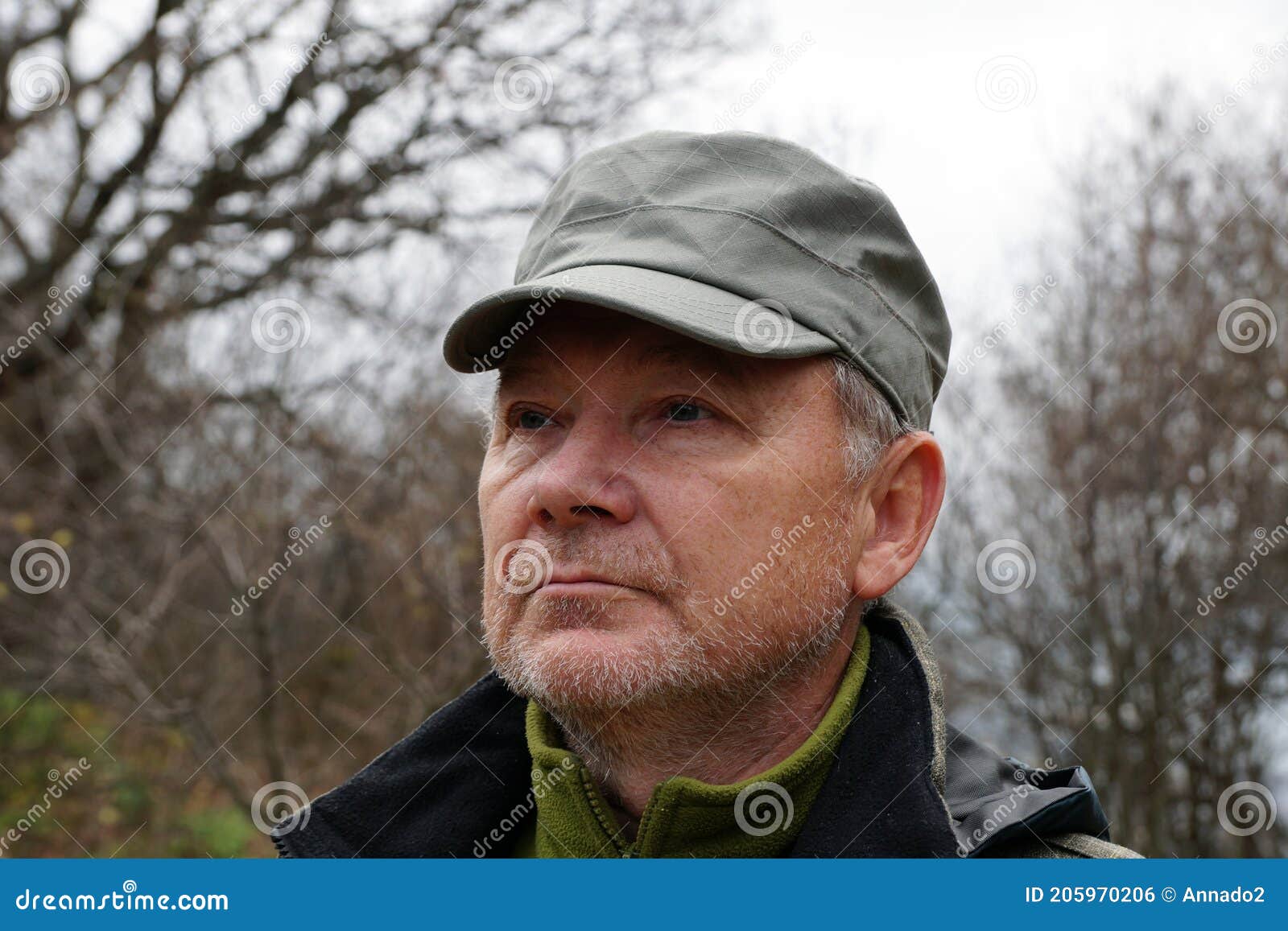 Portrait of an Older Man in a Cap on the Background of Nature Stock ...