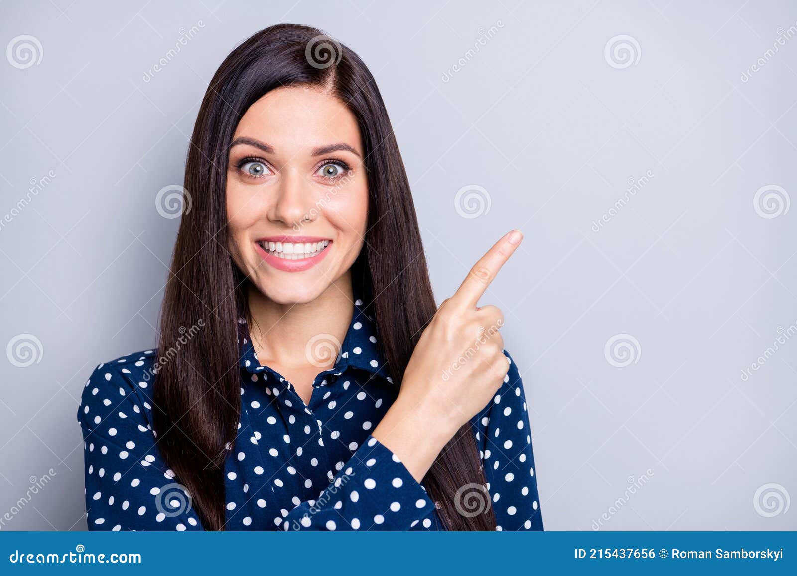Portrait Of Optimistic Brunette Girl Point Empty Space Wear Blue Blouse