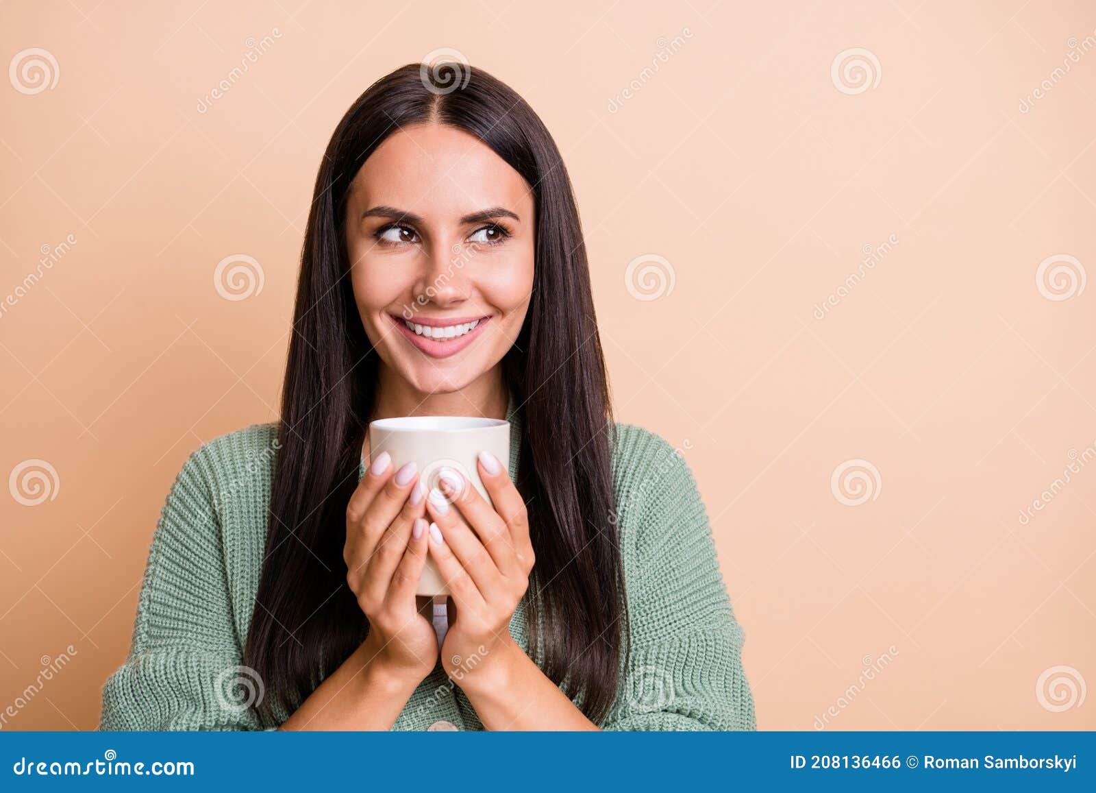 Portrait Of Optimistic Girl Hold Cup Look Empty Space Wear Green