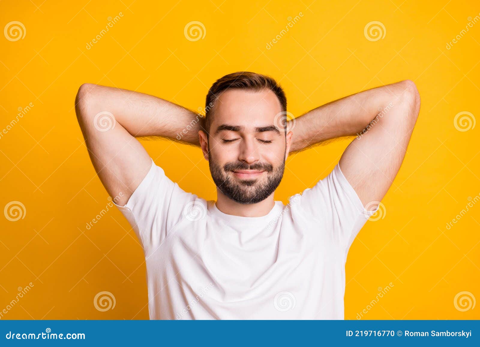 Portrait Of Optimistic Guy Lie Down Closed Eyes Wear White T Shirt