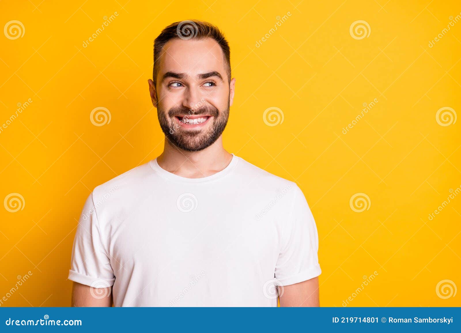 Portrait Of Optimistic Guy Look Empty Space Wear White T Shirt Isolated