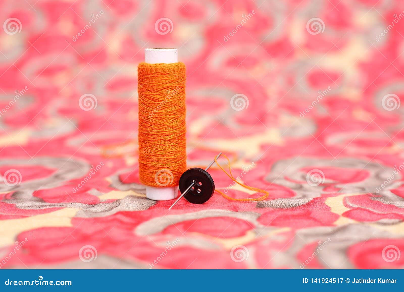 Portrait Of Orange Sewing Thread, Needle And Button Stock Image - Image ...