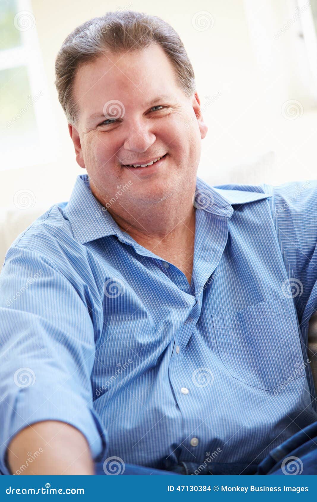 Portrait of Overweight Man Sitting on Sofa Stock Photo - Image of home ...