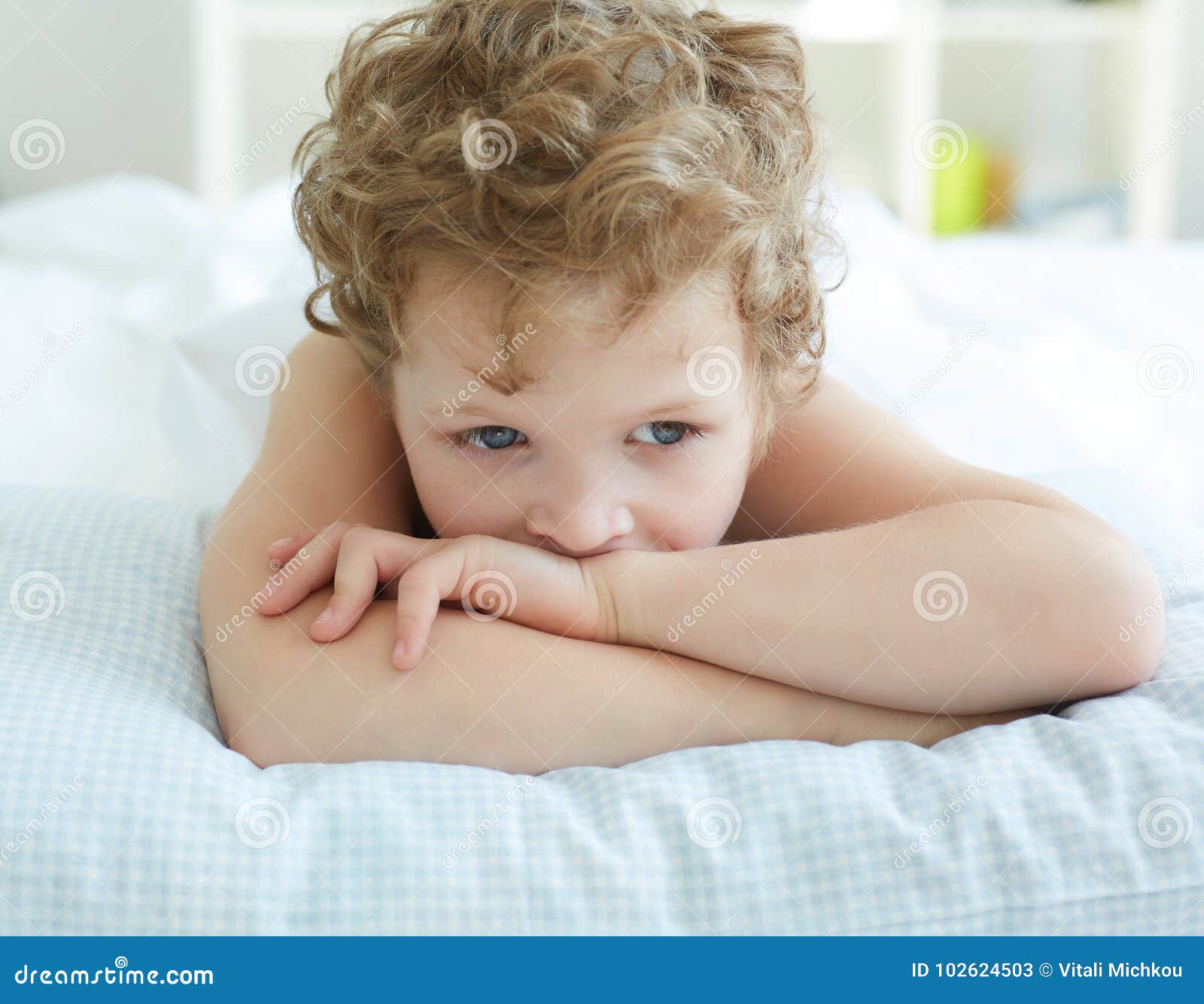 Portrait of Pensive Little Boy Lying on Bed. Stock Image - Image of ...