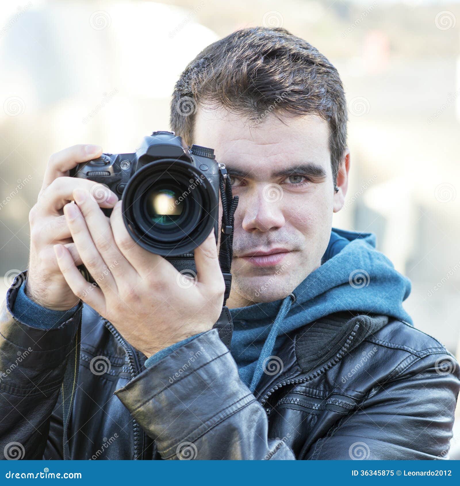Portrait of Photographer Using Professional Camera. Stock Image - Image ...