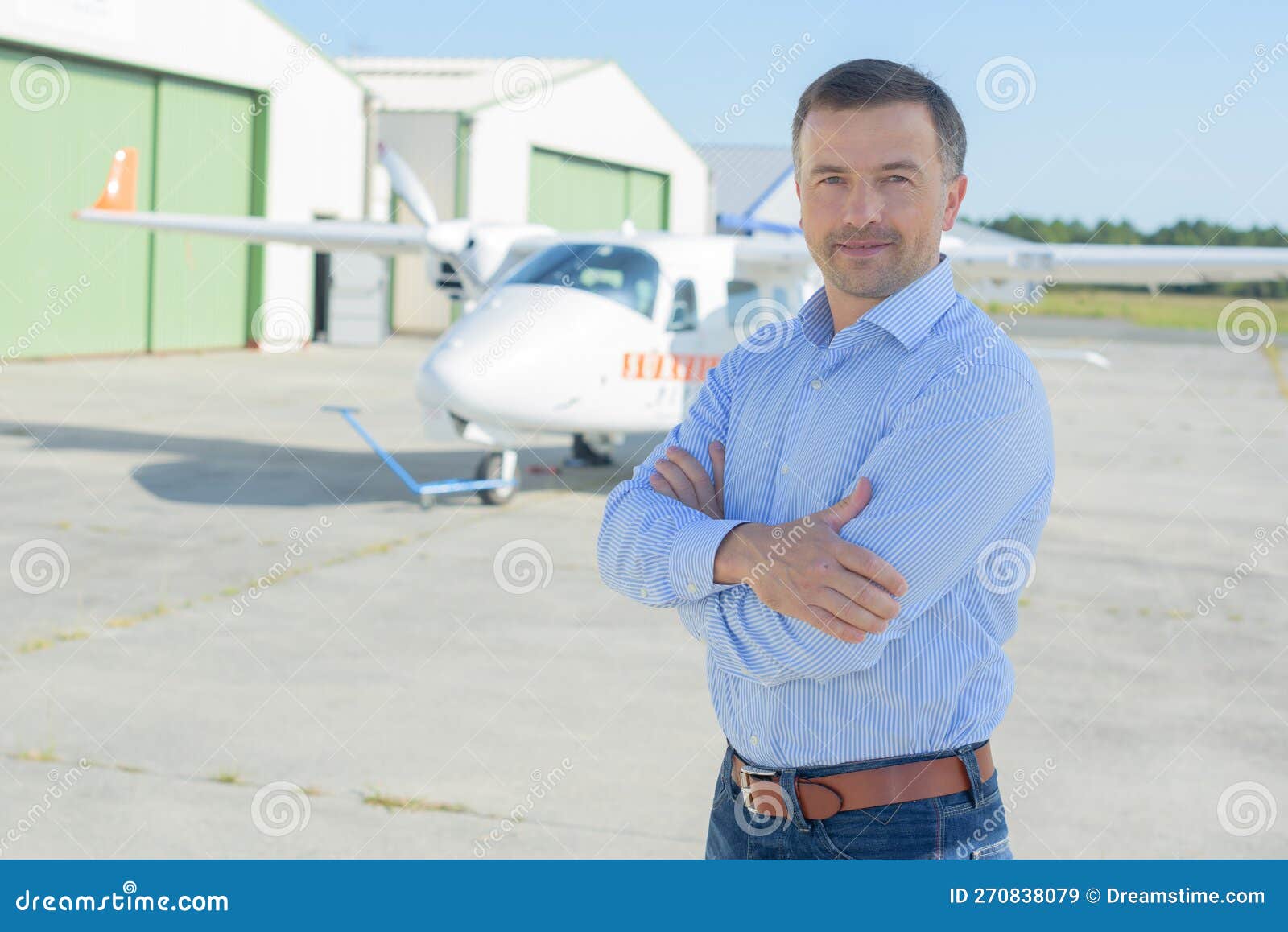 Portrait Pilot beside Plane Stock Image - Image of airport, wealthy ...