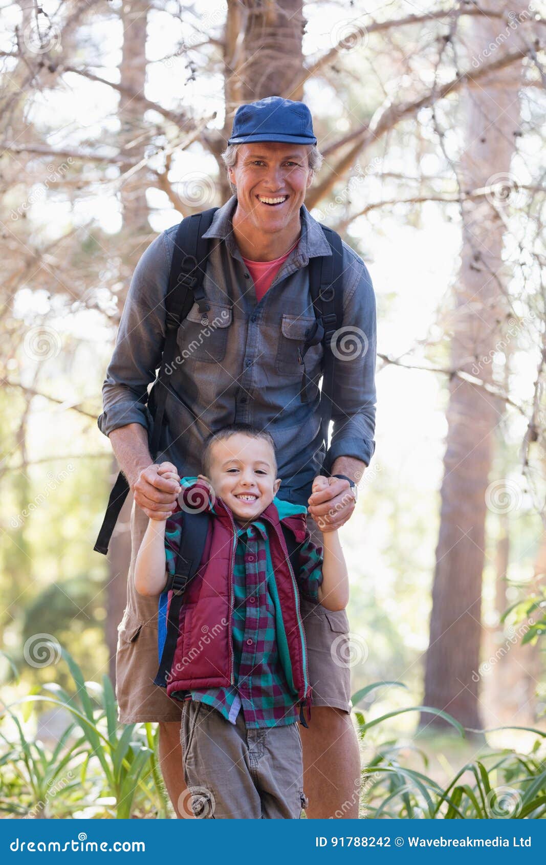 Portrait of Playful Father and Son in Forest Stock Photo - Image of ...
