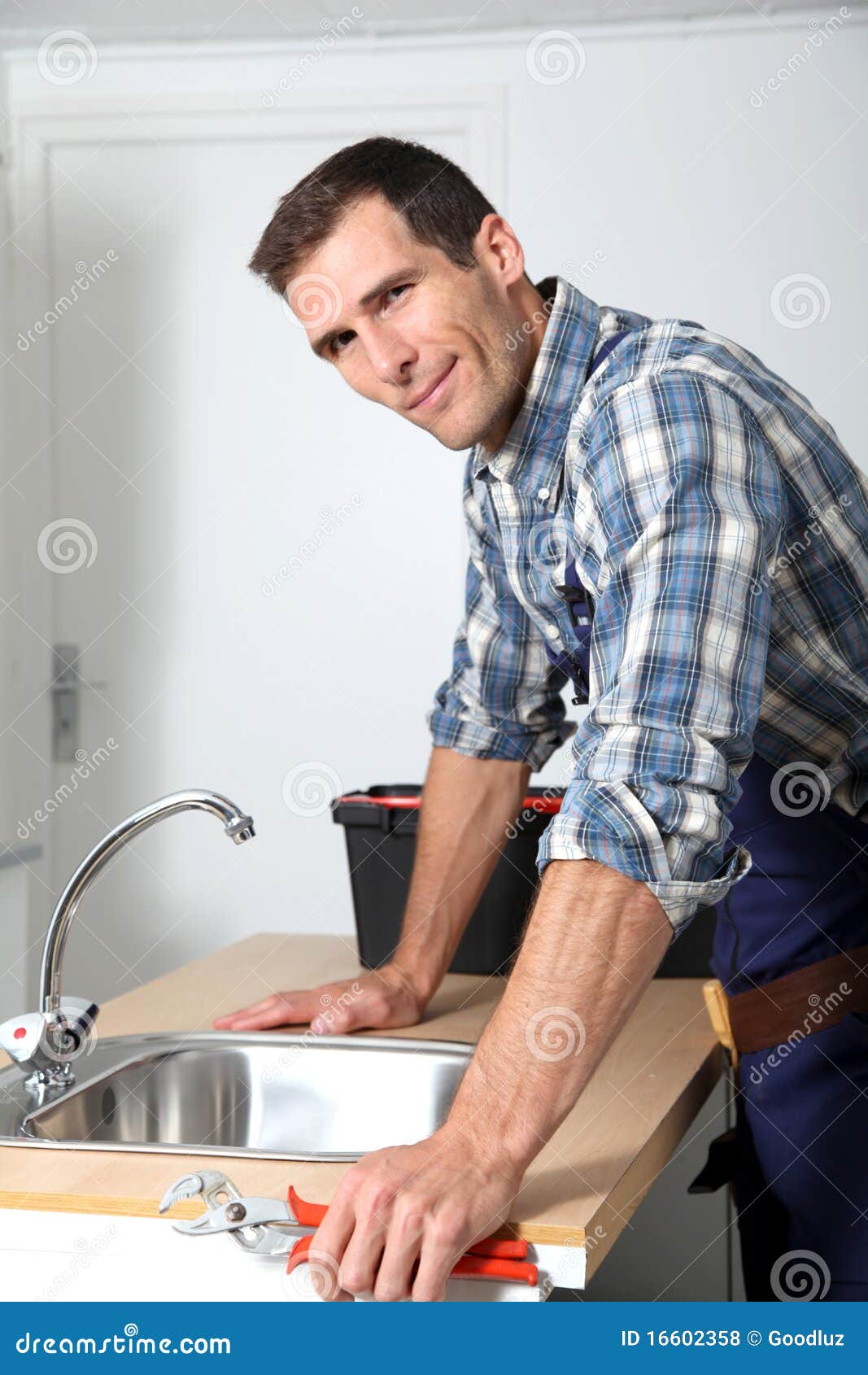 Portrait of plumber stock photo. Image of home, service - 16602358