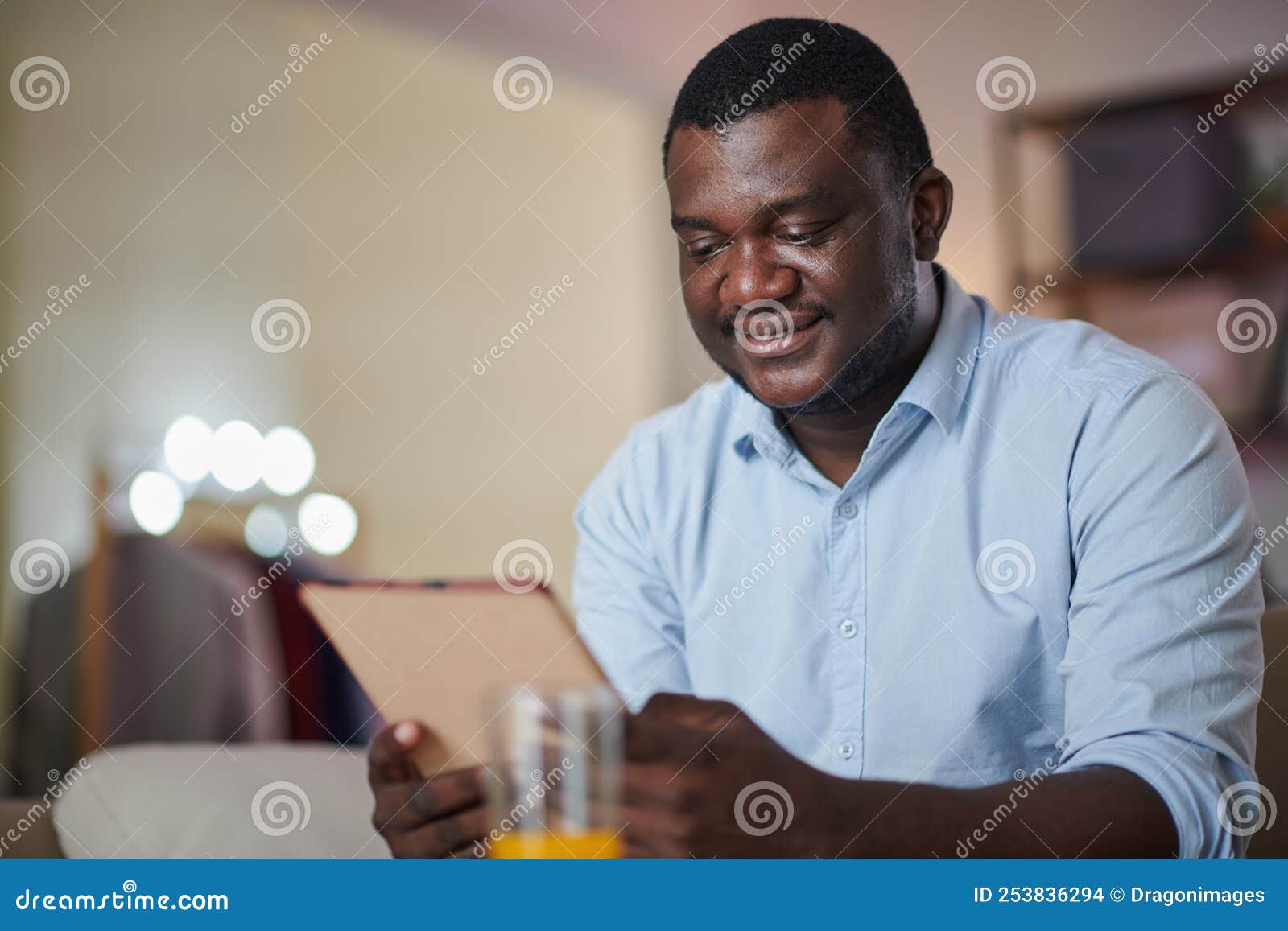 Man Reading Article on Tablet Computer Stock Photo - Image of news ...