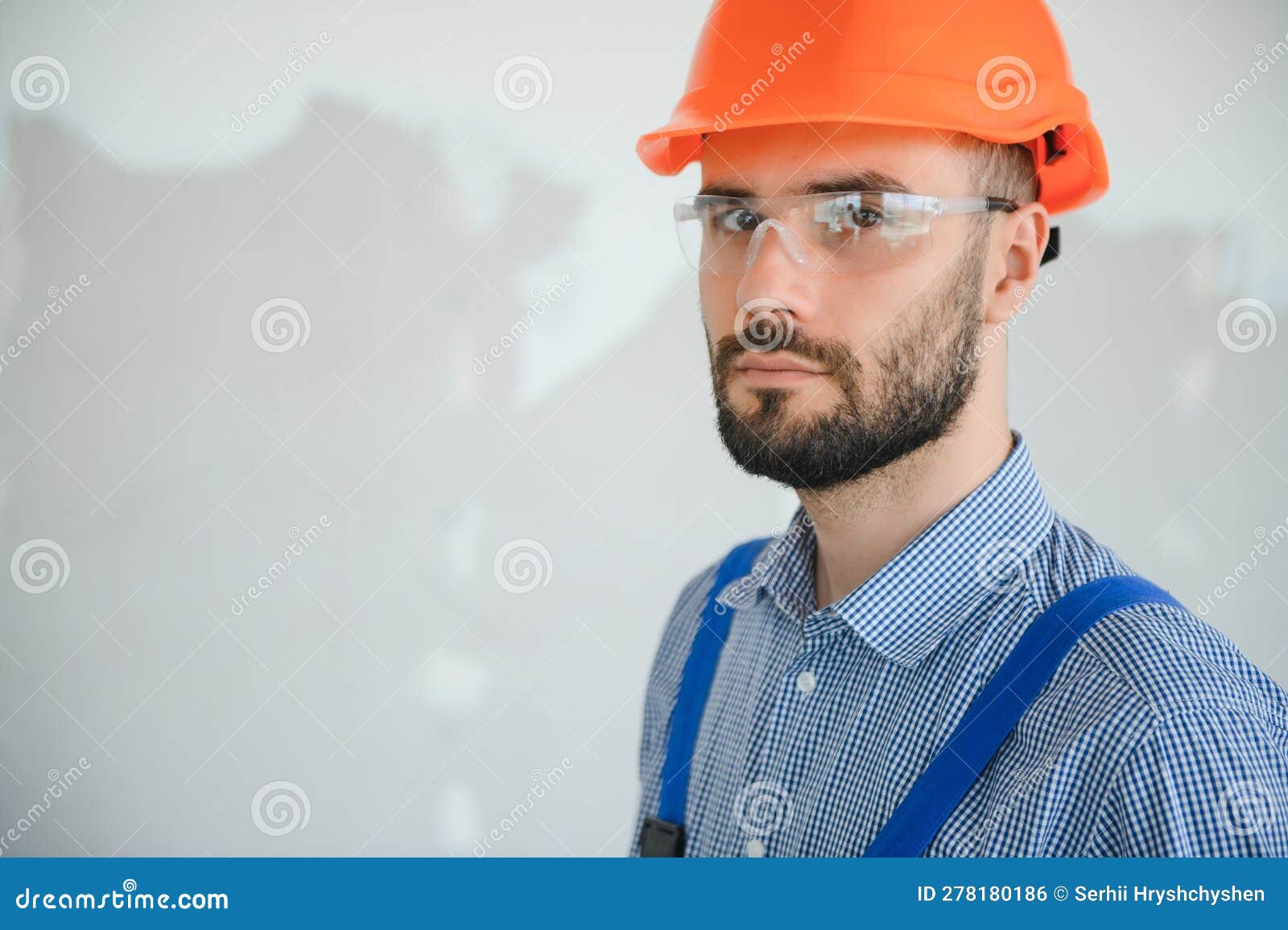 Portrait of Positive, Handsome Young Male Builder in Hard Hat while ...