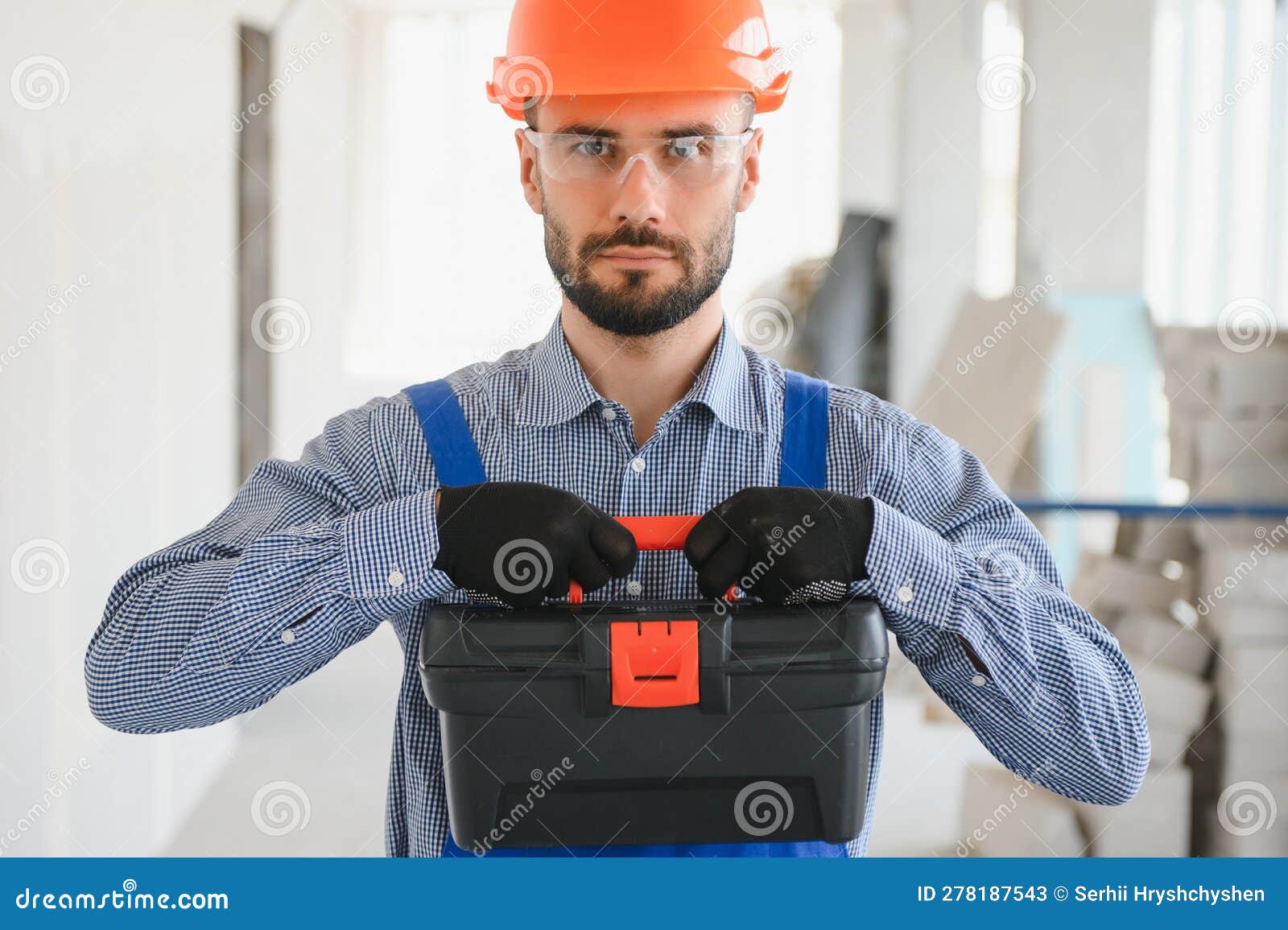 Portrait of Positive, Handsome Young Male Builder in Hard Hat while ...