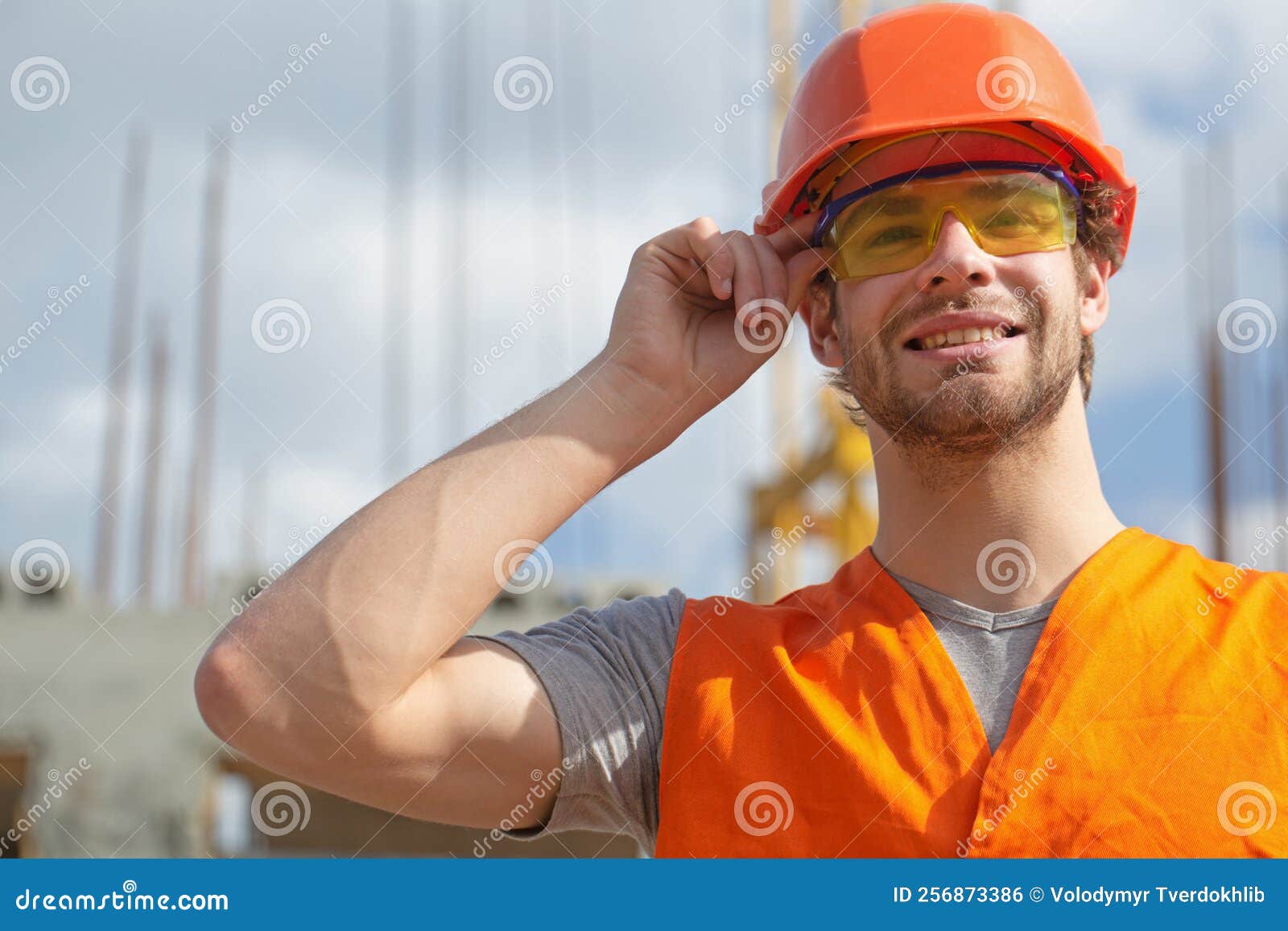 Portrait of Positive Male Builder in Hardhat Working at Construction ...