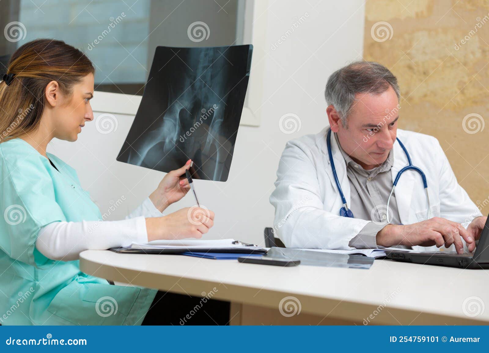Portrait Practitioner Examining Pelvic Xray Stock Image - Image of ...