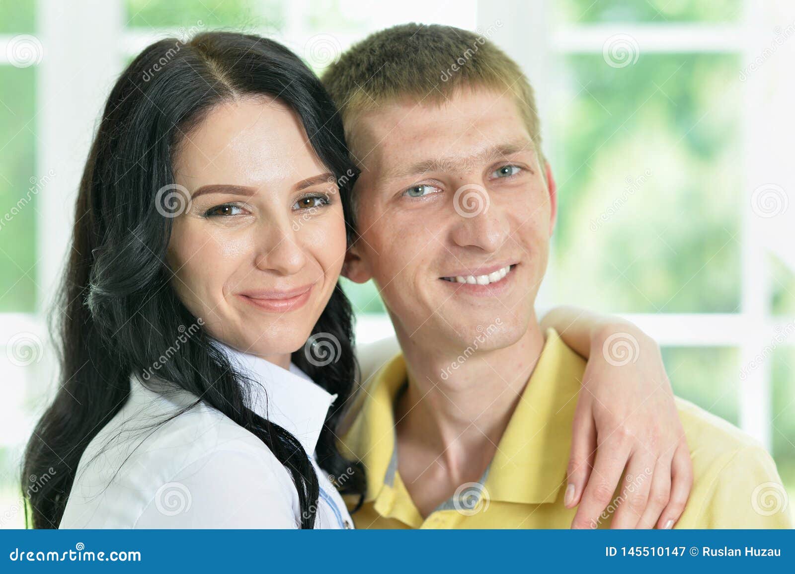 Portrait of a Pretty Couple Posing at Home Stock Image - Image of ...