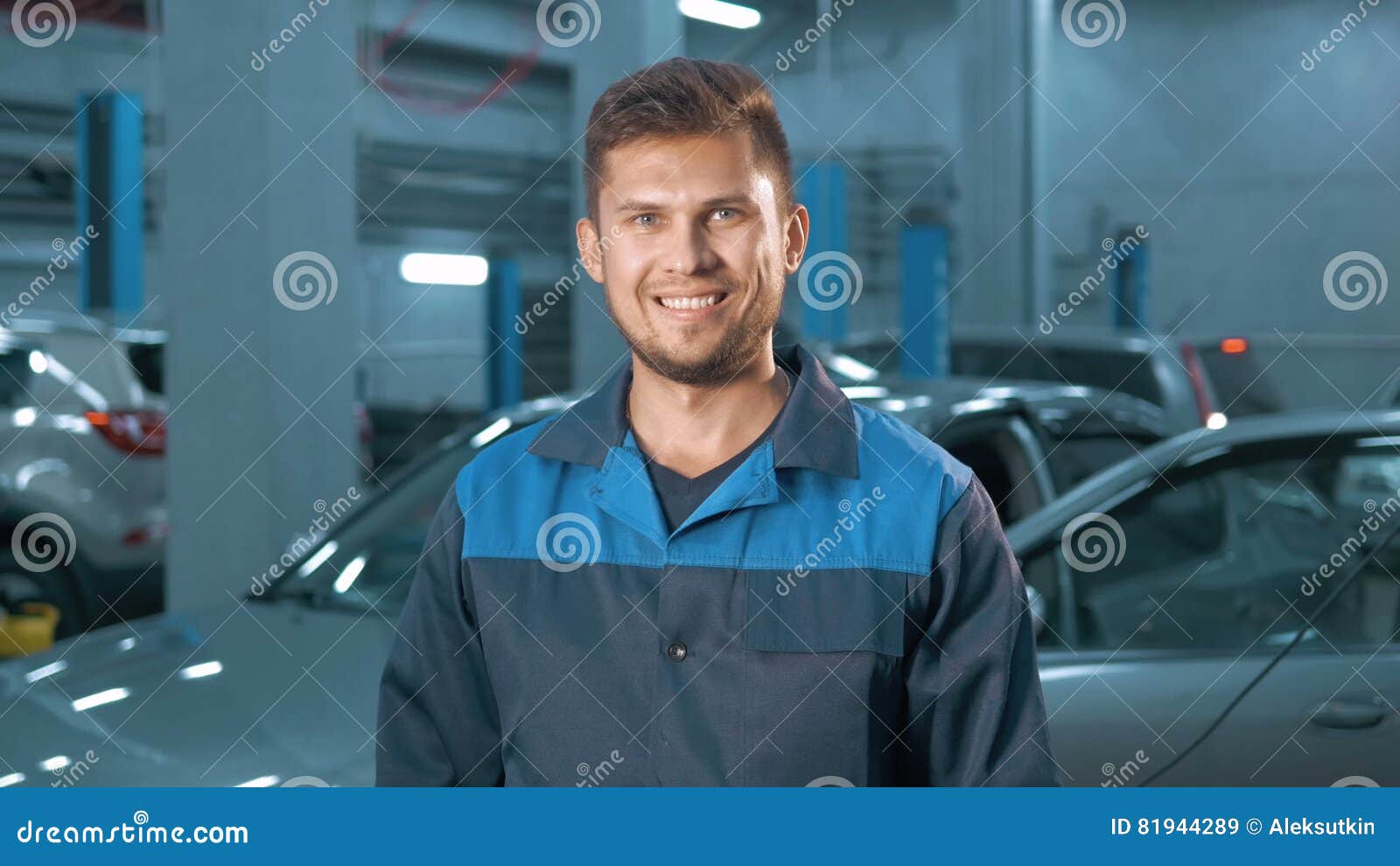 Portrait of Professional Smiling Car Mechanic Working in Modern Auto ... Portrait of Professional Smiling Car Mechanic Working in Modern Auto ...