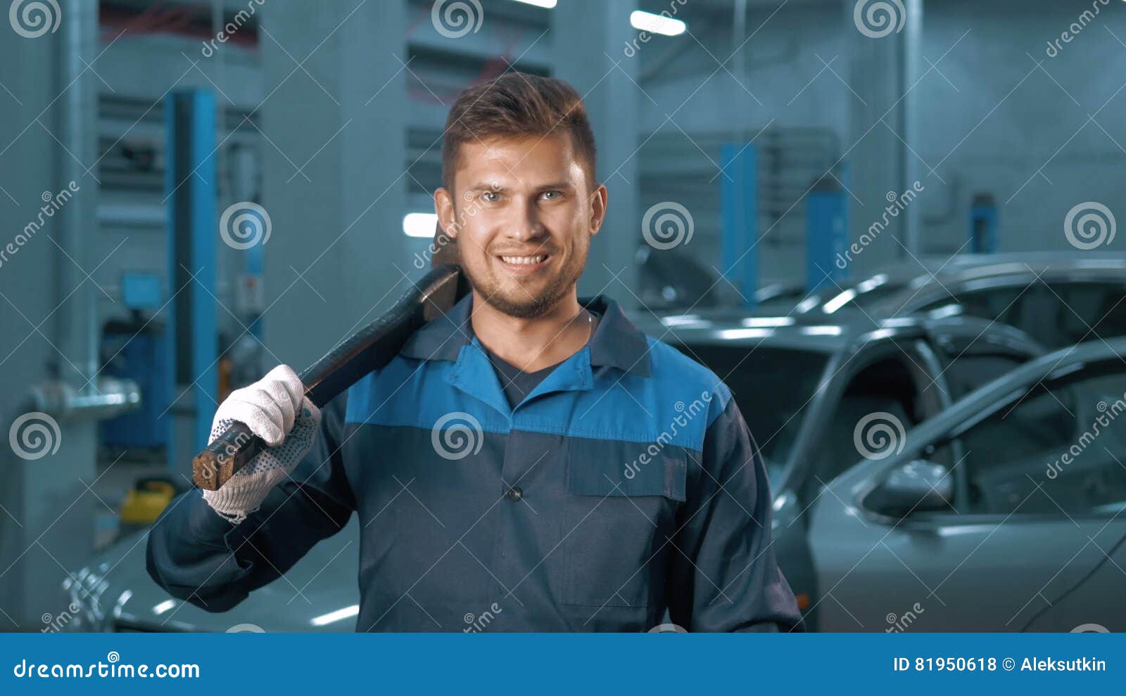 Portrait of Professional Smiling Car Mechanic Working in Modern Auto ... Portrait of Professional Smiling Car Mechanic Working in Modern Auto ...