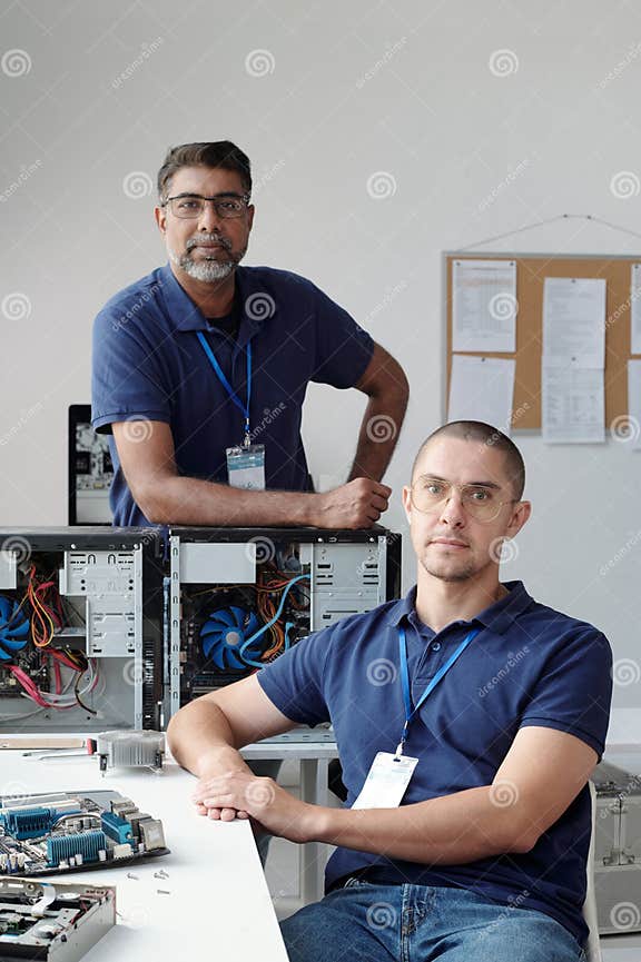 Portrait of it Professionals Working on Computer Hardware Stock Photo ...