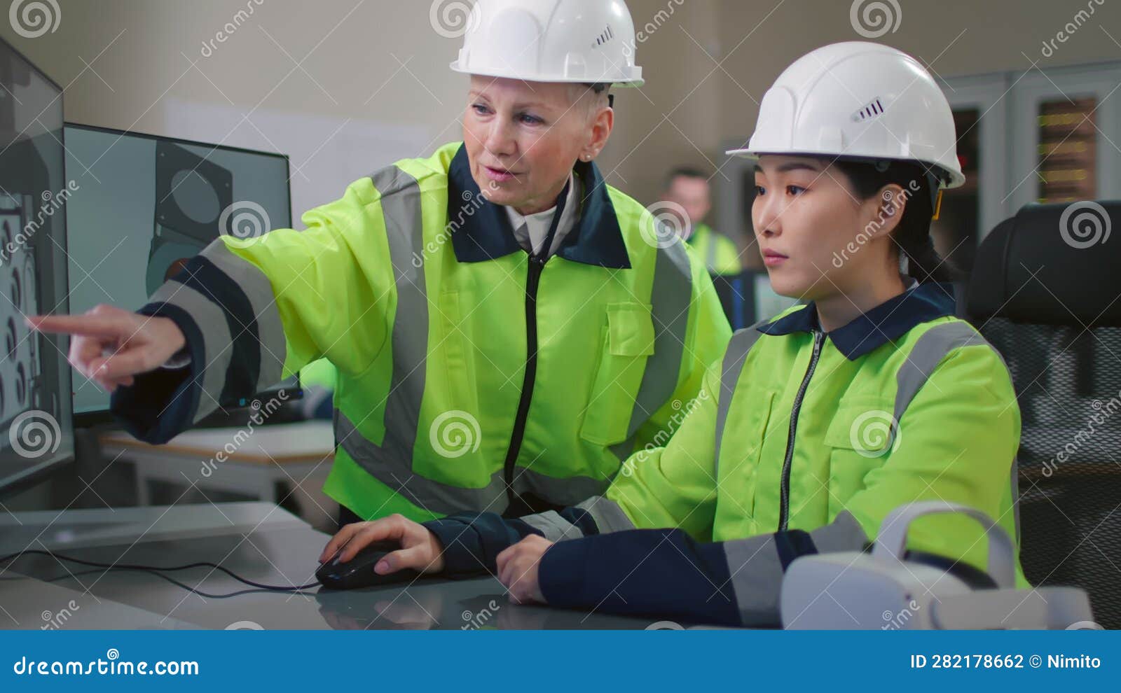 Portrait of Project Supervisor Talking with a Female Industrial ...