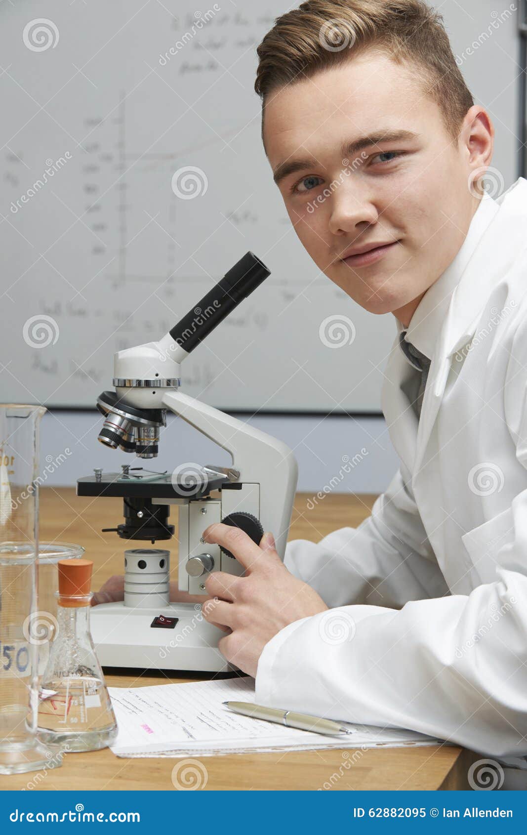 Portrait of Pupil Using Microscope in Science Lesson Stock Image ...