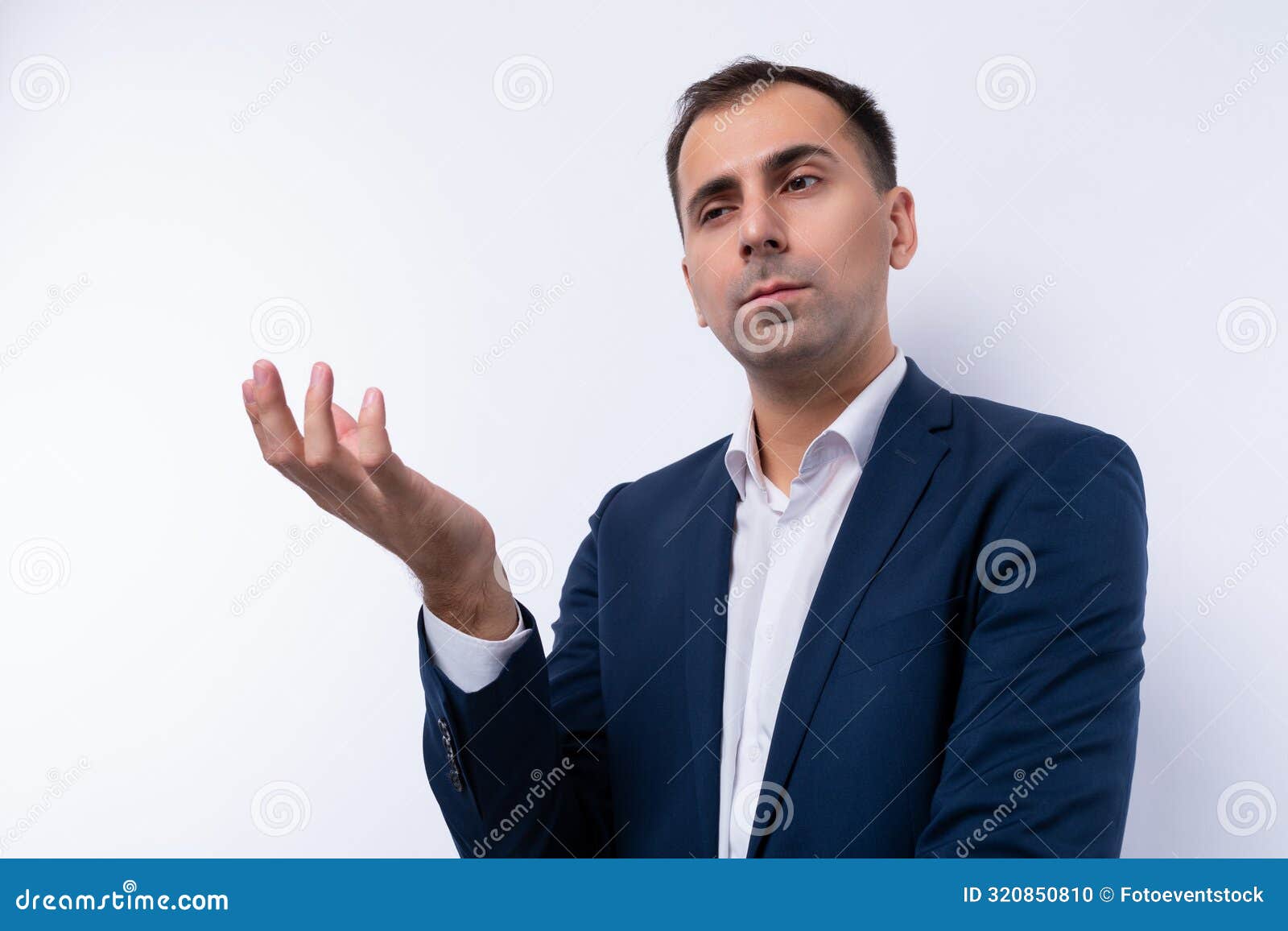 Portrait of a Puzzled Business Man in a Blue Jacket on a White ...