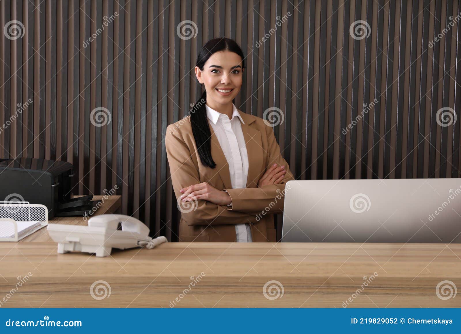 Portrait of Receptionist at Countertop in Office Stock Photo - Image of ...