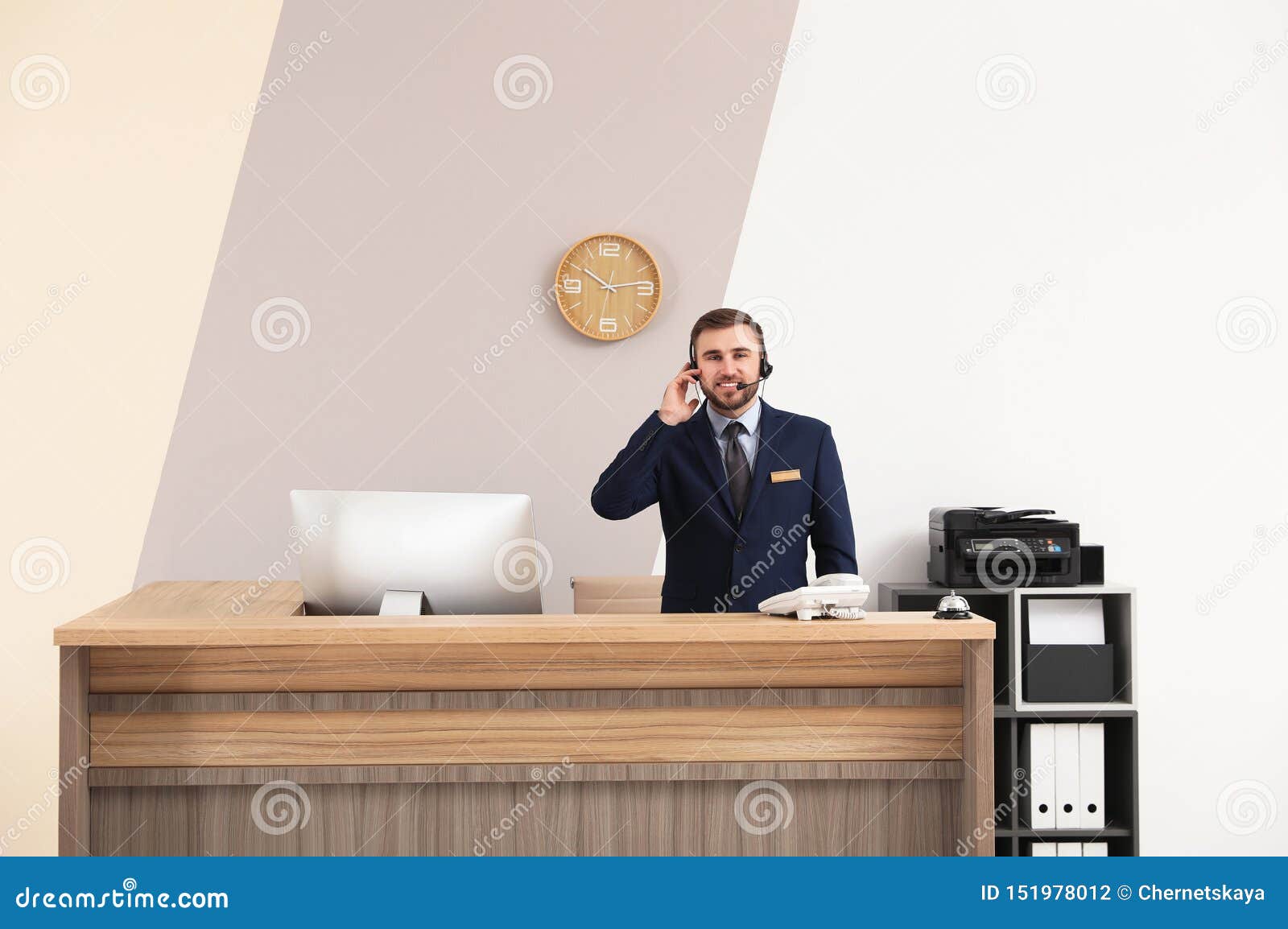 Portrait of Receptionist Working at Desk in Hotel Stock Photo - Image ...